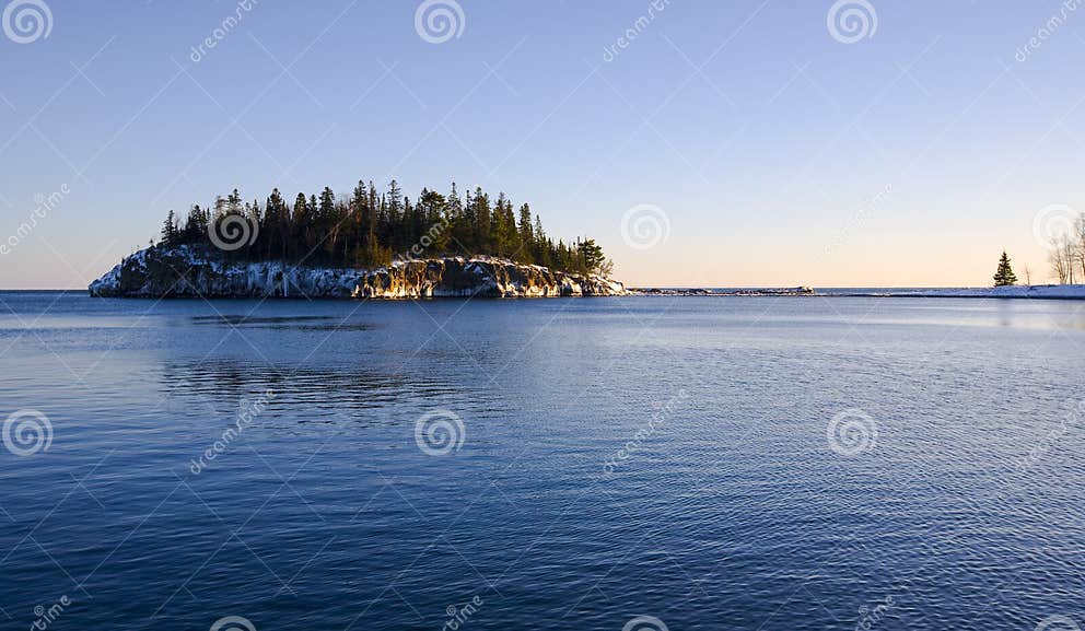 Island in Cold Blue Water stock image. Image of lake, ocean - 7633655