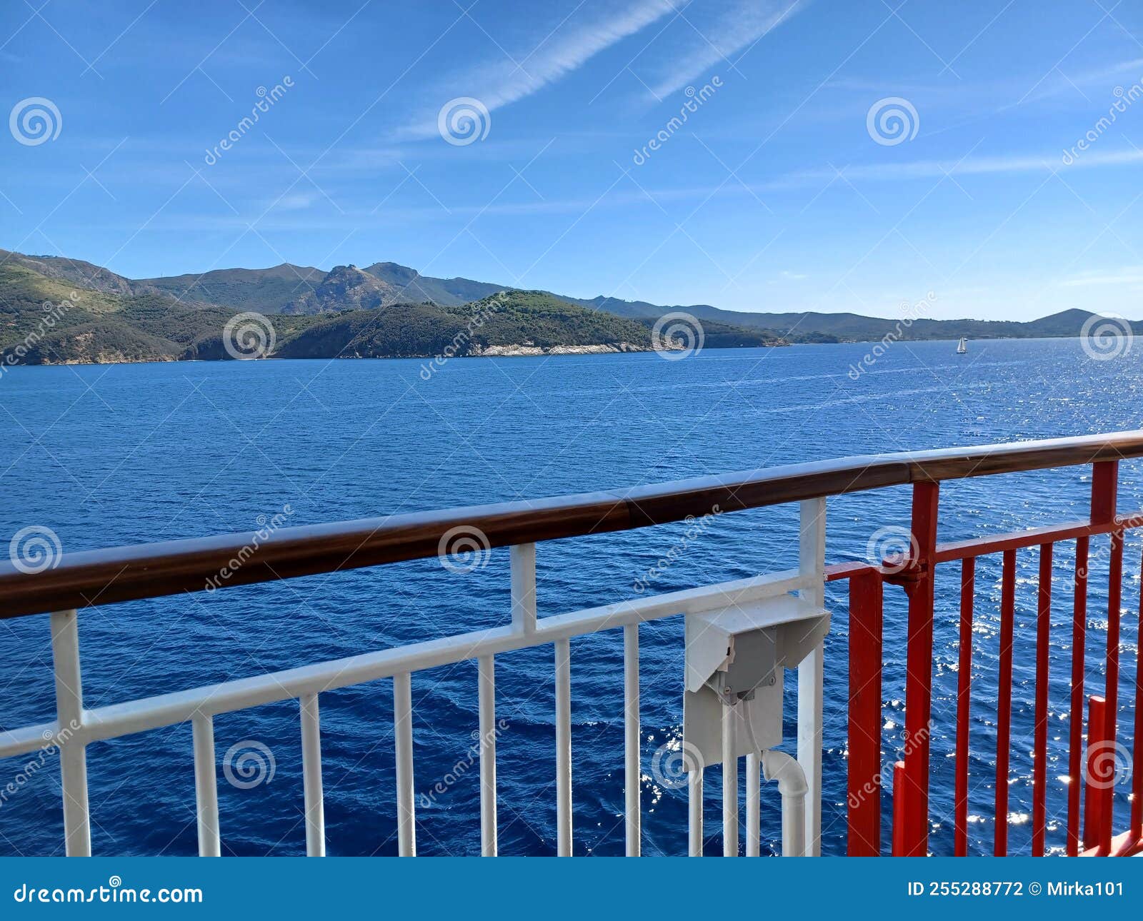 The Island of Elba Seen from the Ferry. the Bridge Railing on the Blue ...