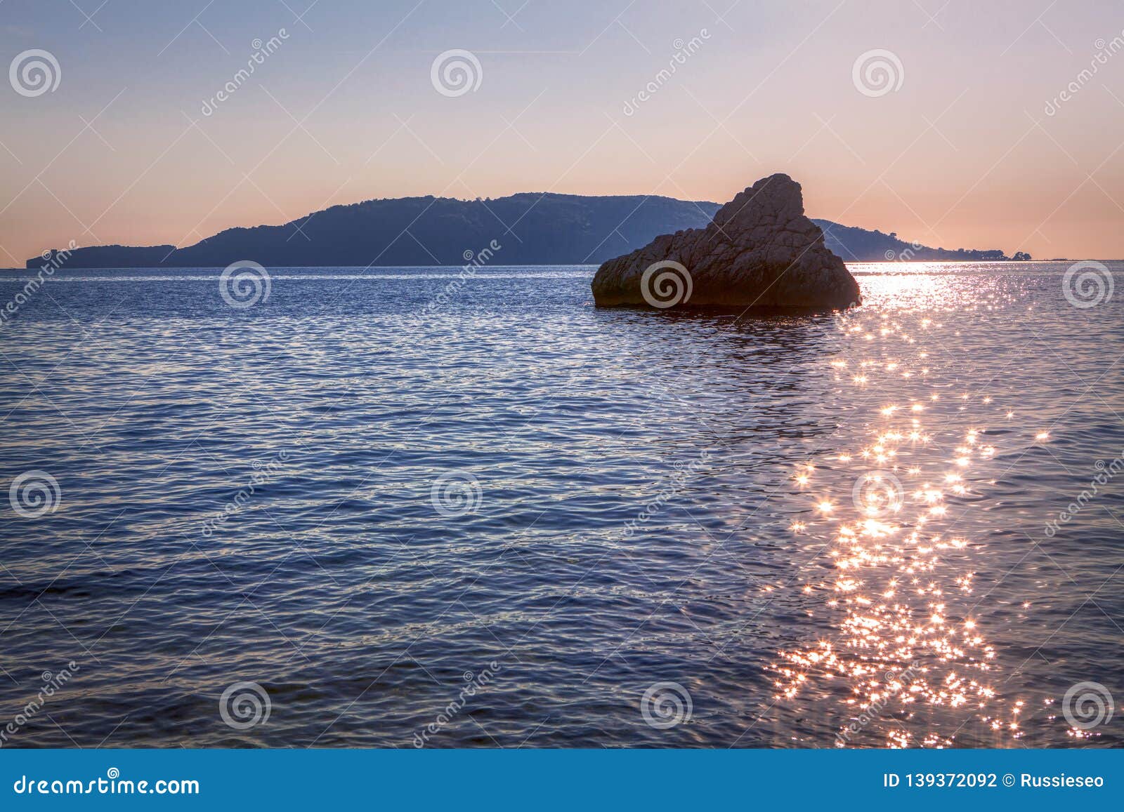 Island in the sunset stock photo. Image of dusk, nature - 139372092