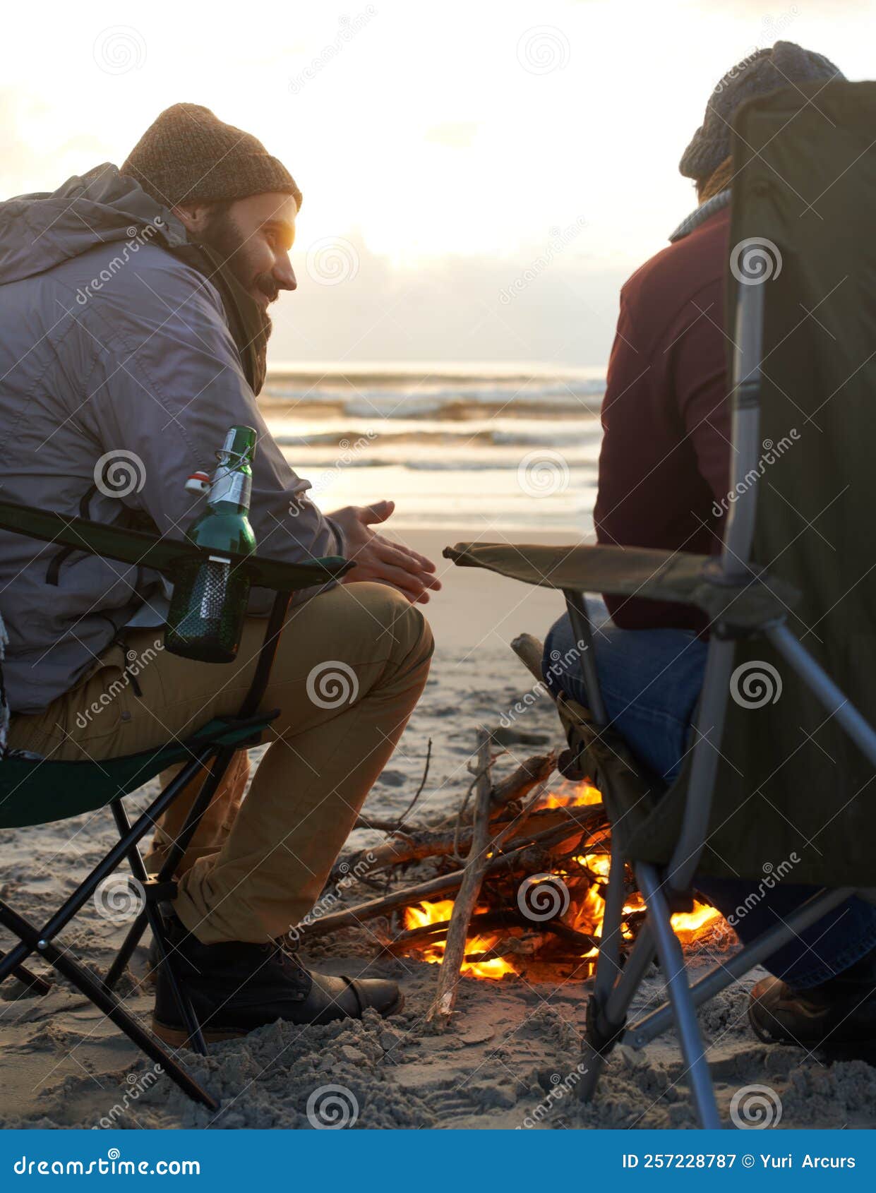 Isnt this the Life. Two Young Men Sitting Around a Fire on the Beach ...