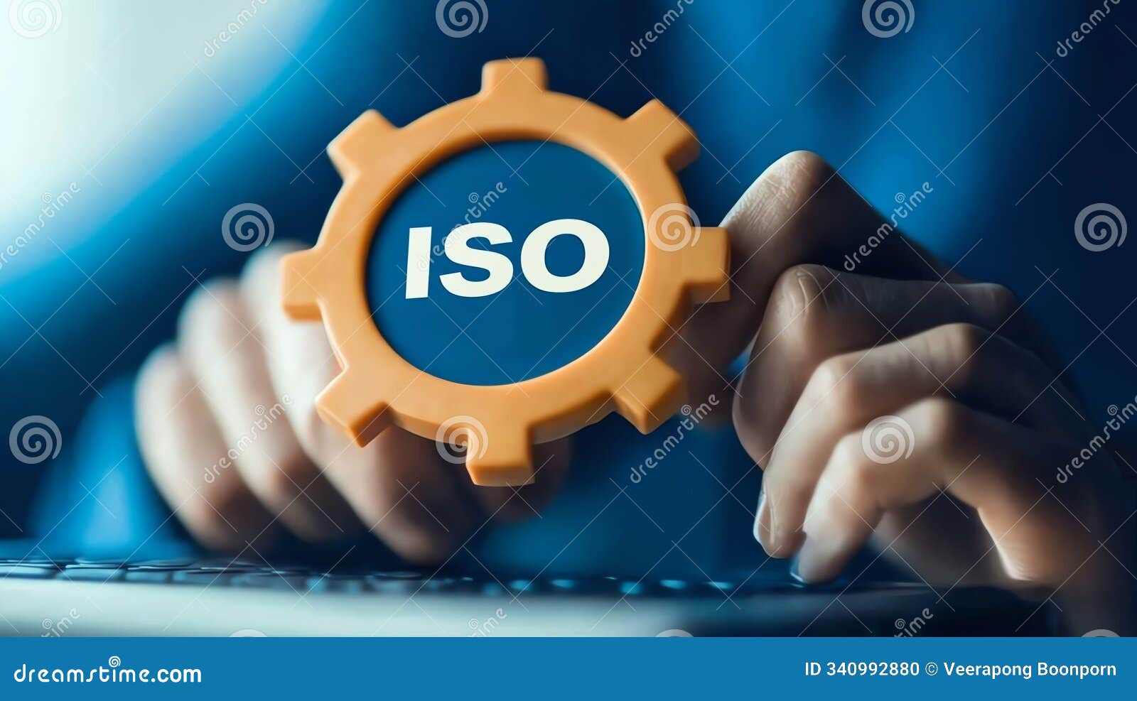 ISO Certification Concept with Gear Symbol Held by Hands Over a ...