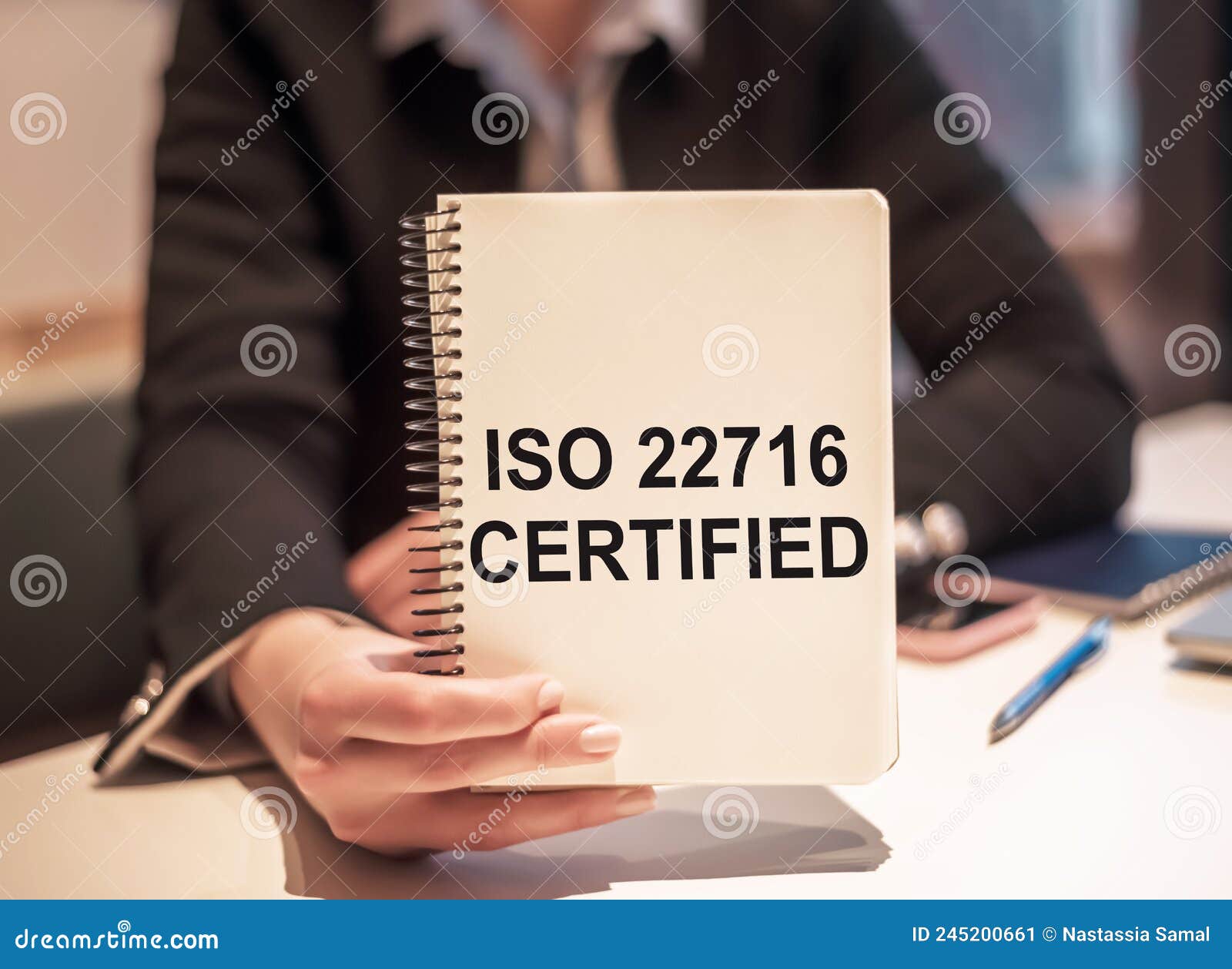 ISO 22716 Certified Text is Written in the Notebook and Shown by a ...