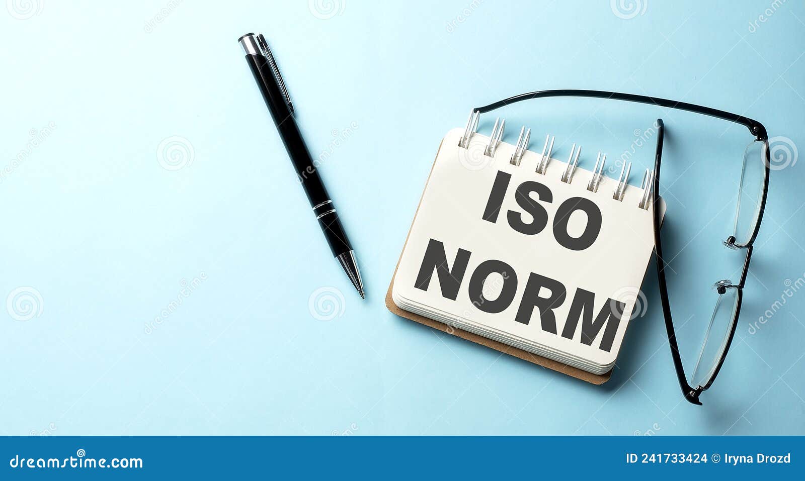 ISO NORM Text Written on a Notepad on the Blue Background Stock Photo ...