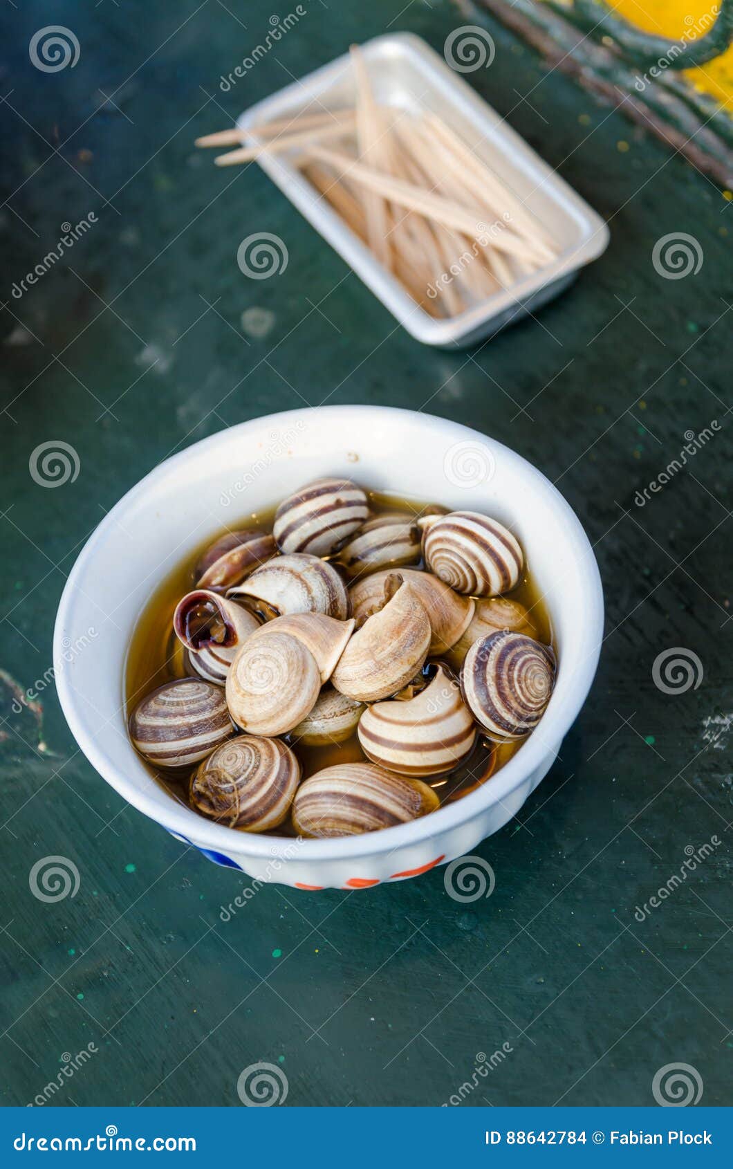 Isolated Boiled or Cooked Snails with Striped Shells in Smaall Bowl ...