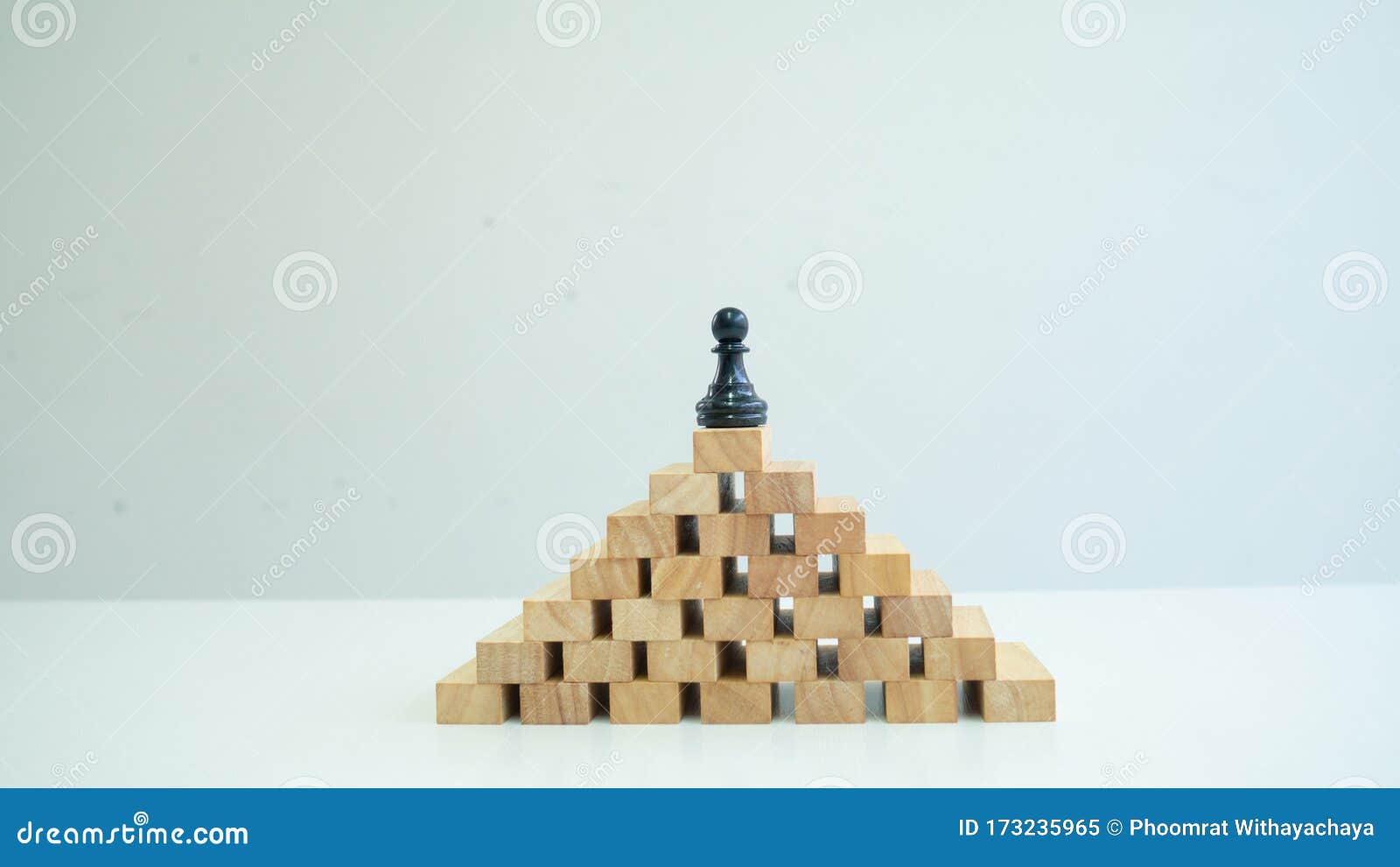 Isolated Chess on Top of Pyramid Shape Wooden Blocks. Business ...