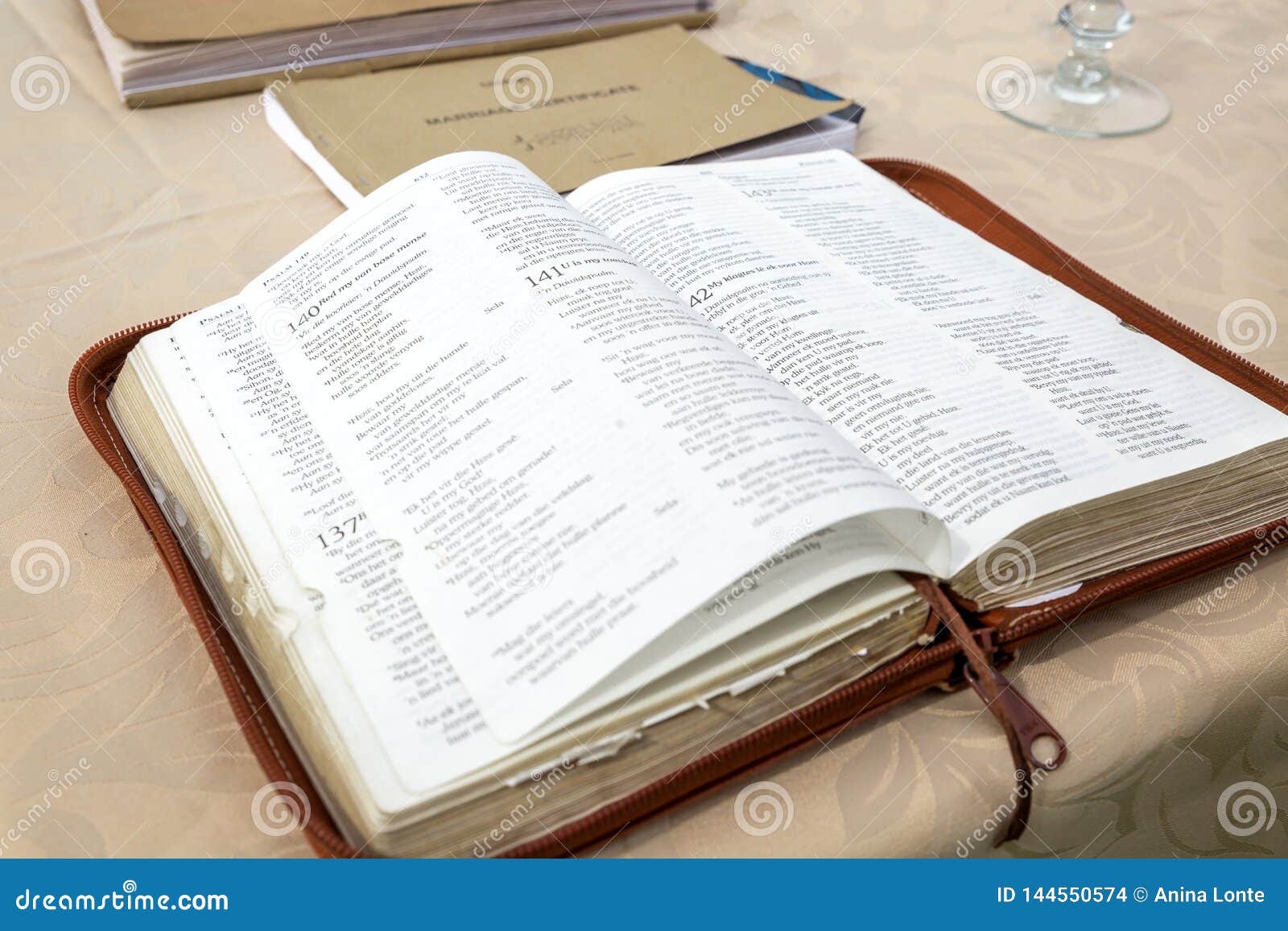 An Isolated, Open Bible Book on a Table Stock Photo - Image of book ...
