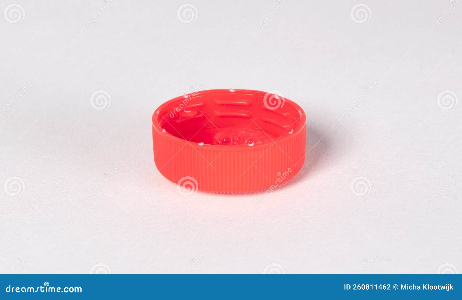 Isolated Red Plastic Cap - Concept of Pollution Stock Photo - Image of ...
