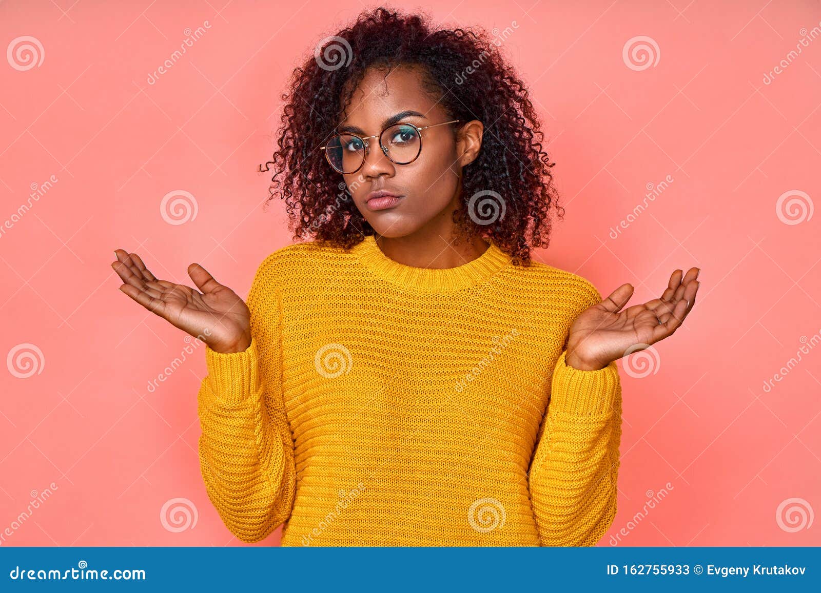 Isolated Shot of Confused Beautiful Woman with Dark Skin, Curly Haircut ... Isolated Shot of Confused Beautiful Woman with Dark Skin, Curly Haircut ...