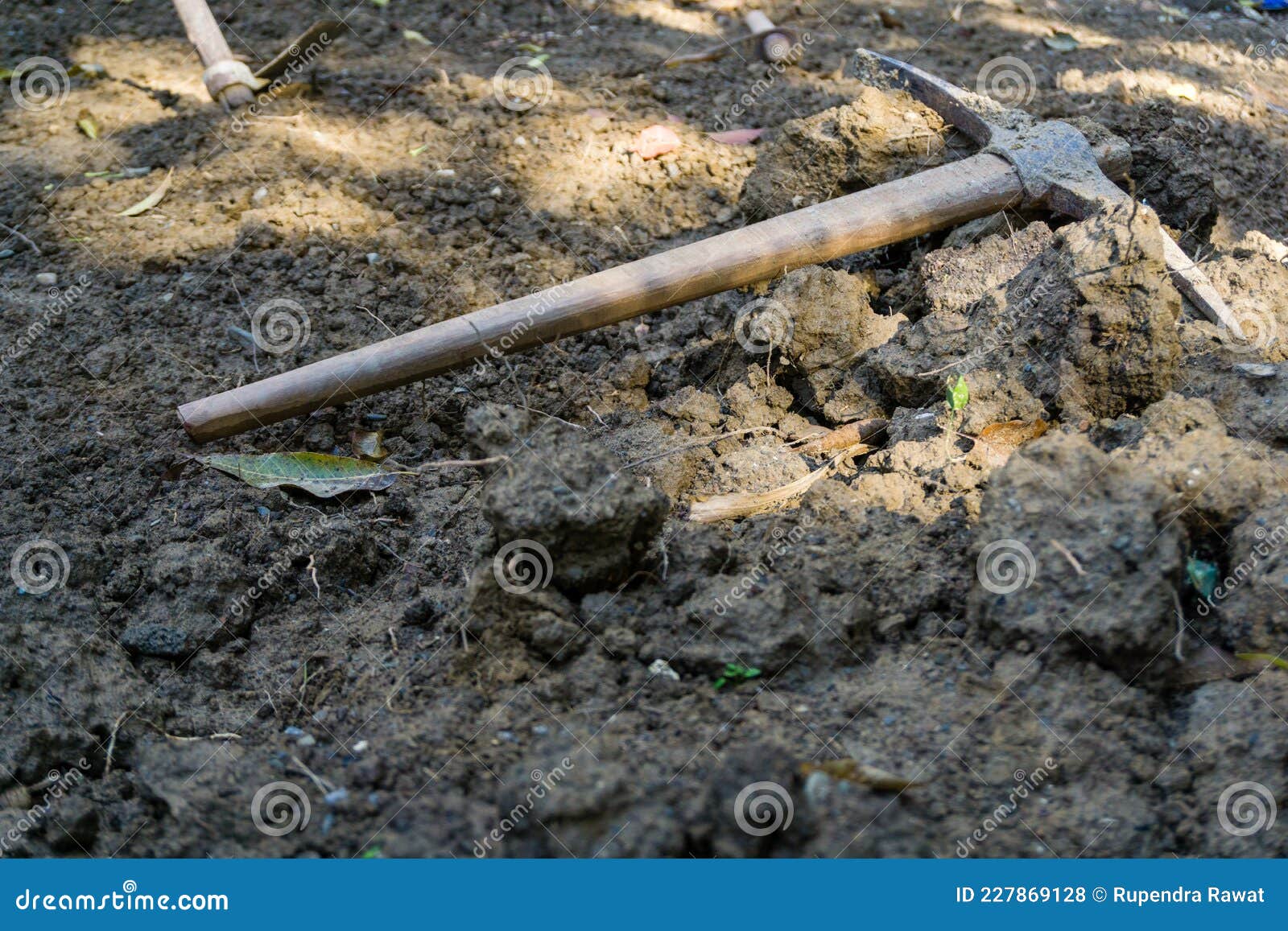 Pickaxe Hoe Lying On The Ground. Hand-held Percussion Tool Designed For ...