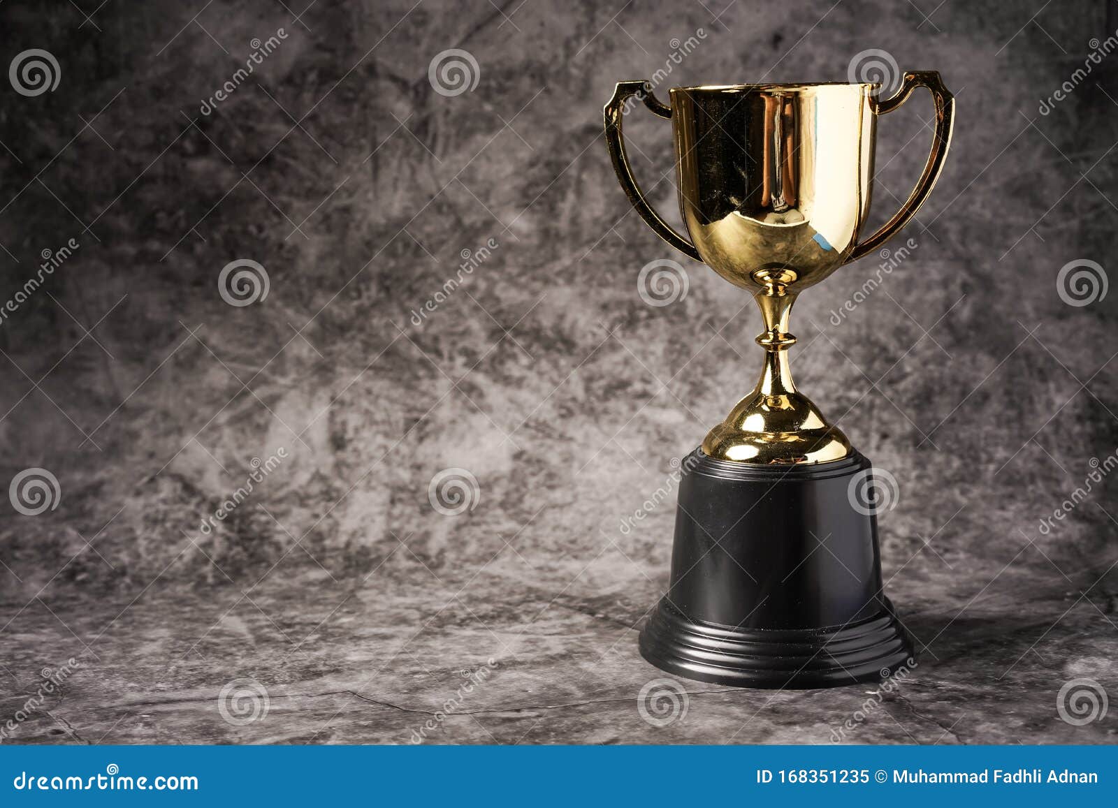 Trophy on grey background stock image. Image of champ - 168351235