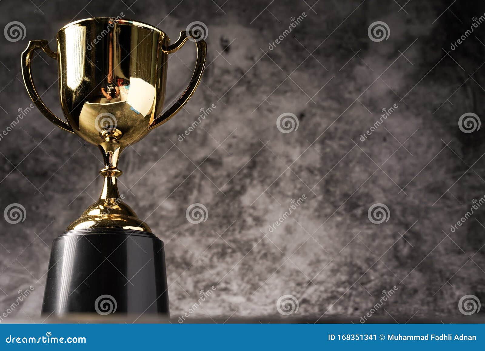 Trophy on grey background stock image. Image of closeup - 168351341