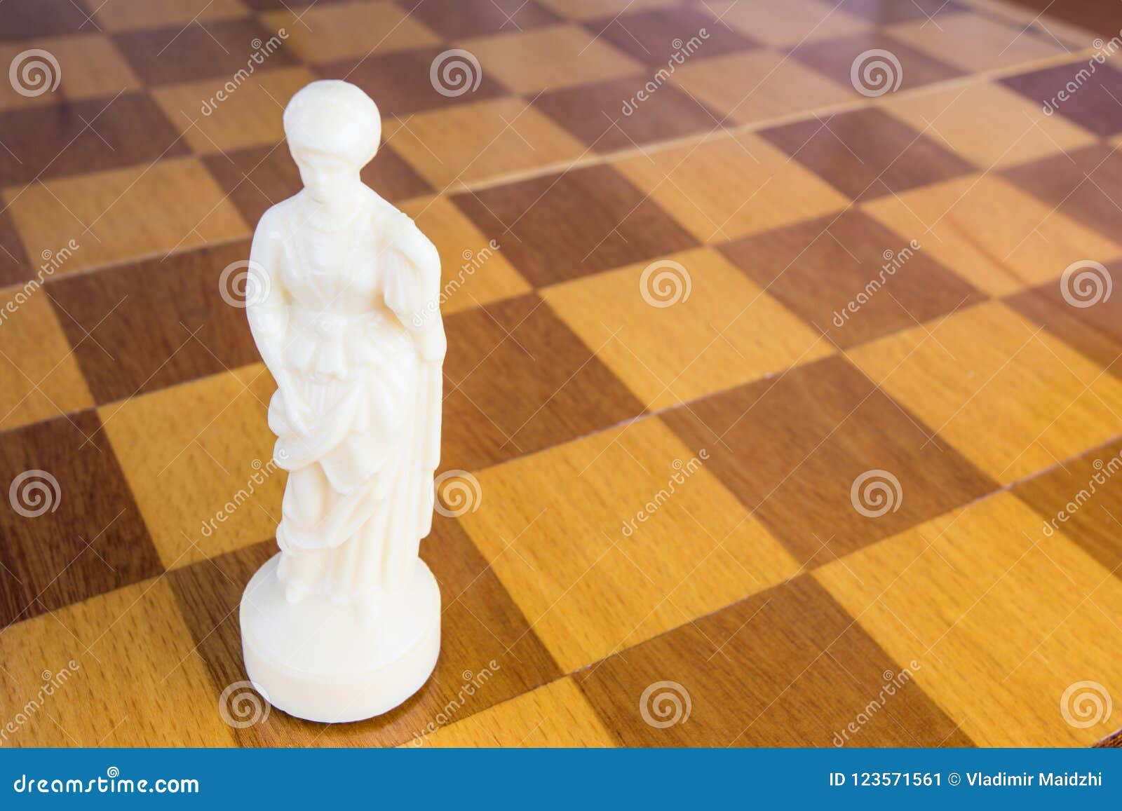 The Isolated White Chess Queen of Stone on the Square Wood Board Stock ...