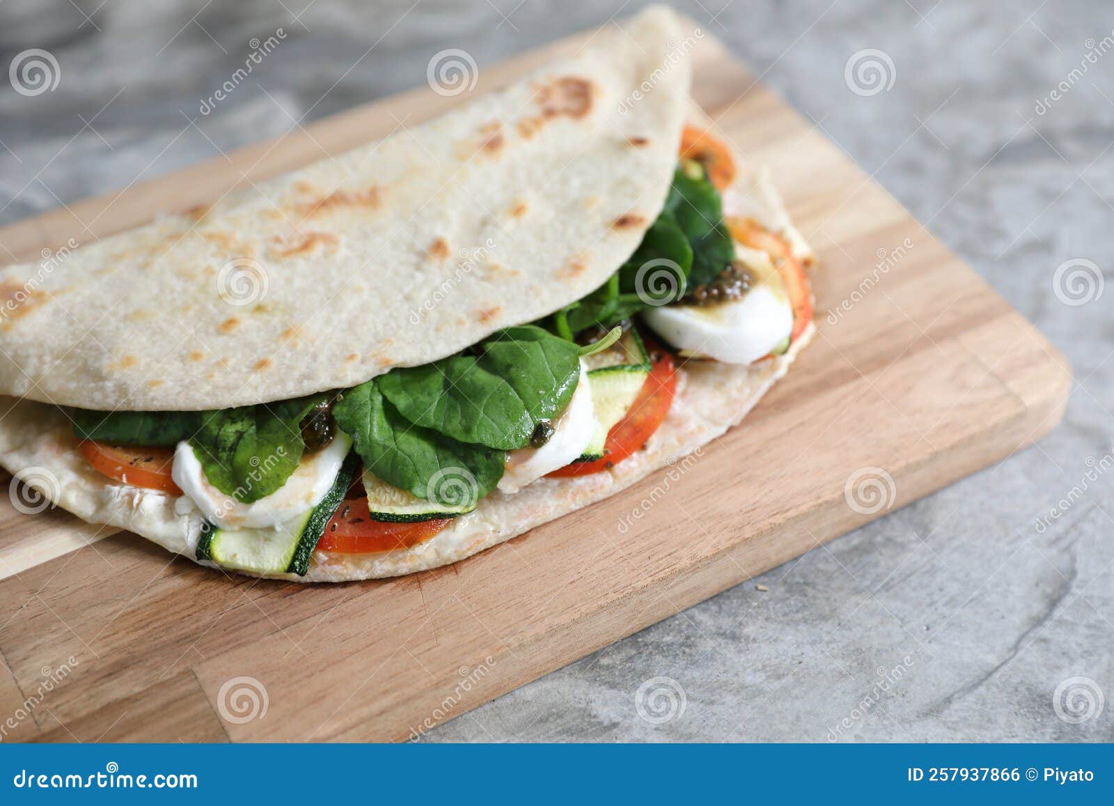 Italian Cuisine , Piadina with Tomatoes and Cheese Stock Photo - Image ...