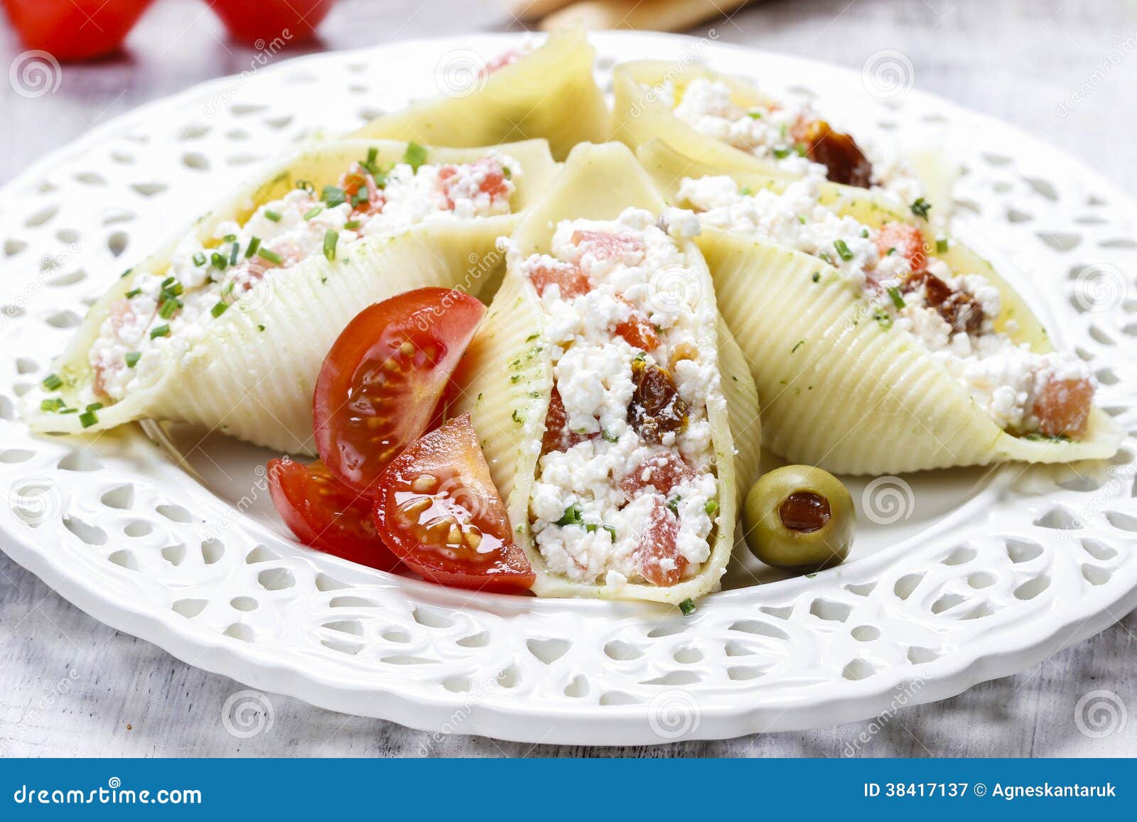 Italian Cuisine: Stuffed Pasta Shells on White Plate. Stock Image ...