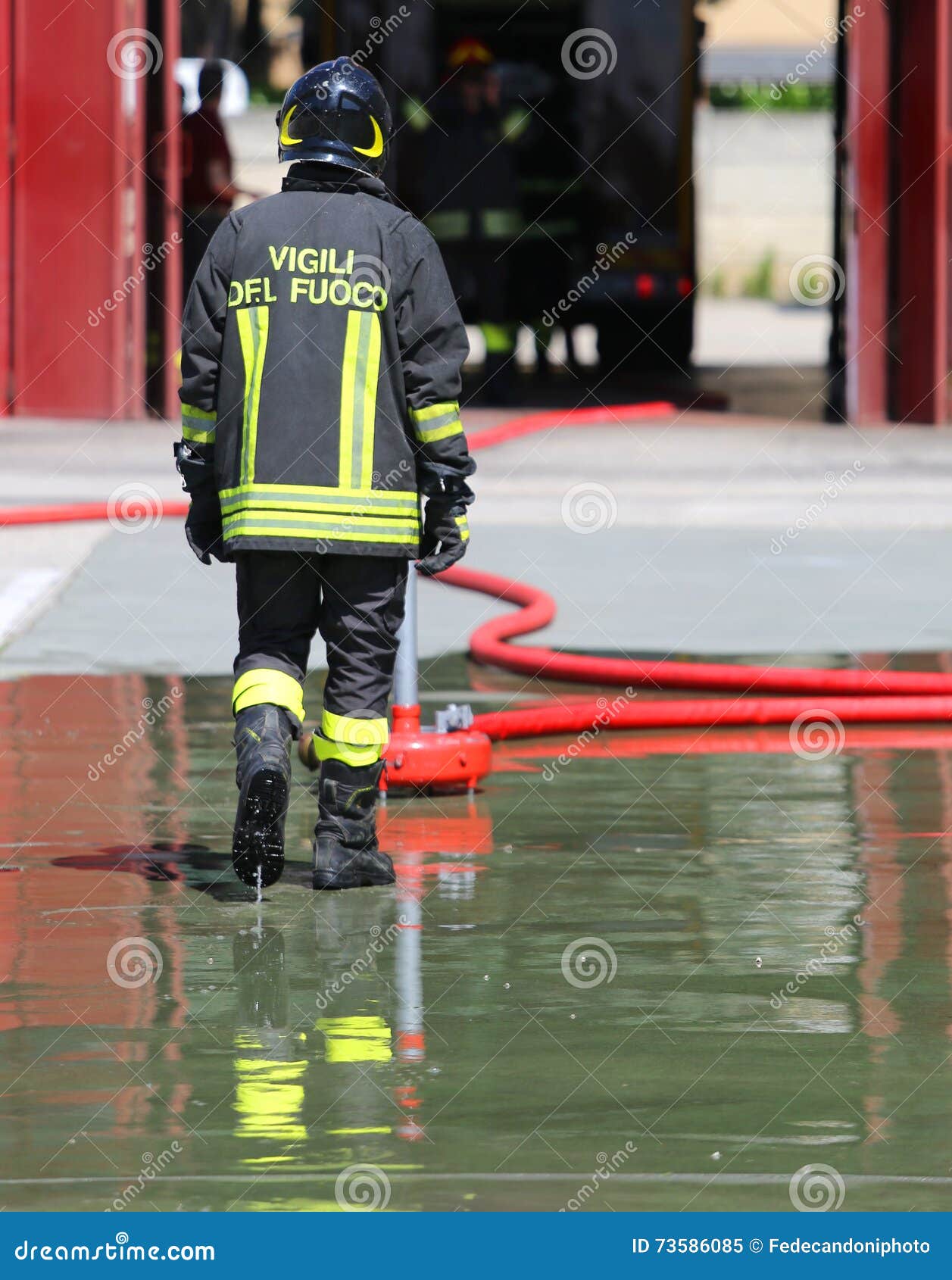 Italian Fireman with Protective Uniform and Helmet on His Head Stock ...