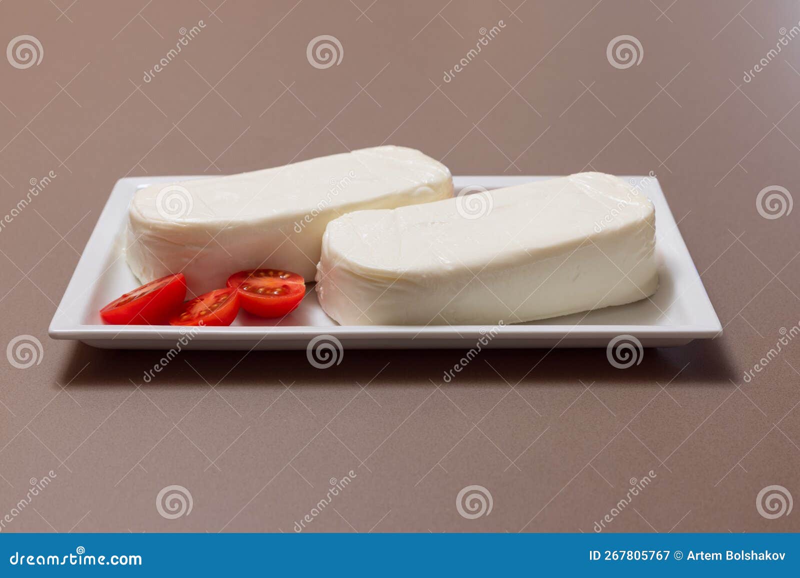 Italian Mozzarella Cheese for Pizza on a White Rectangular Plate Stock ...