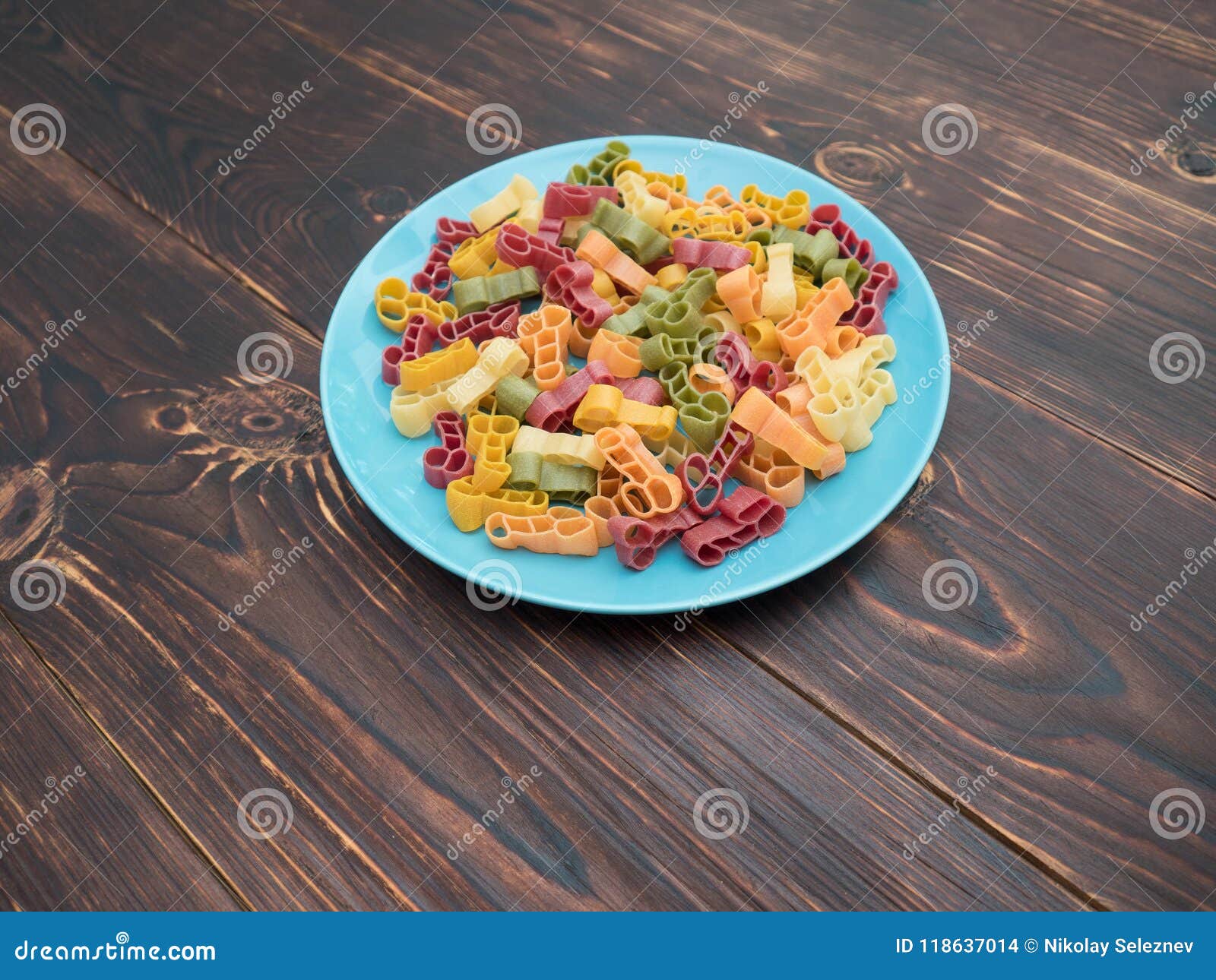Italian Multicolored Paste of Unusual Shape on a Plate Stock Photo ...