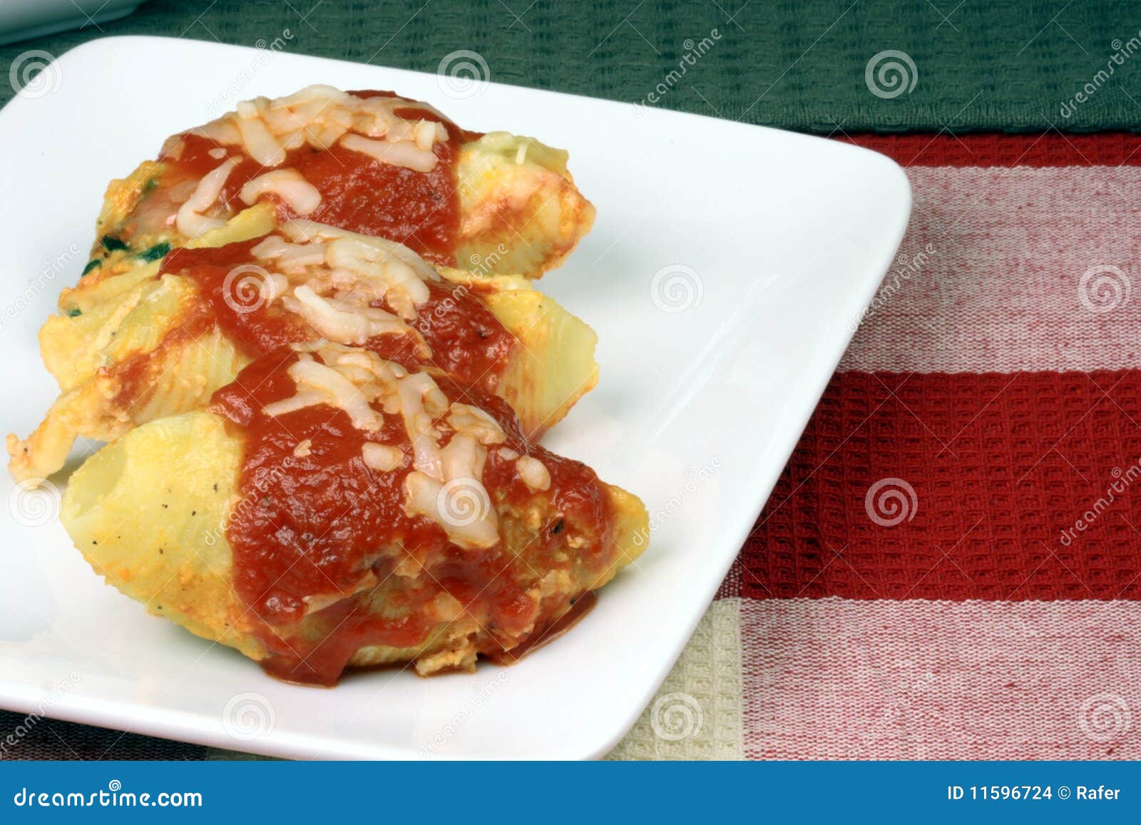 Italian pasta shell rolls stock photo. Image of cooking - 11596724