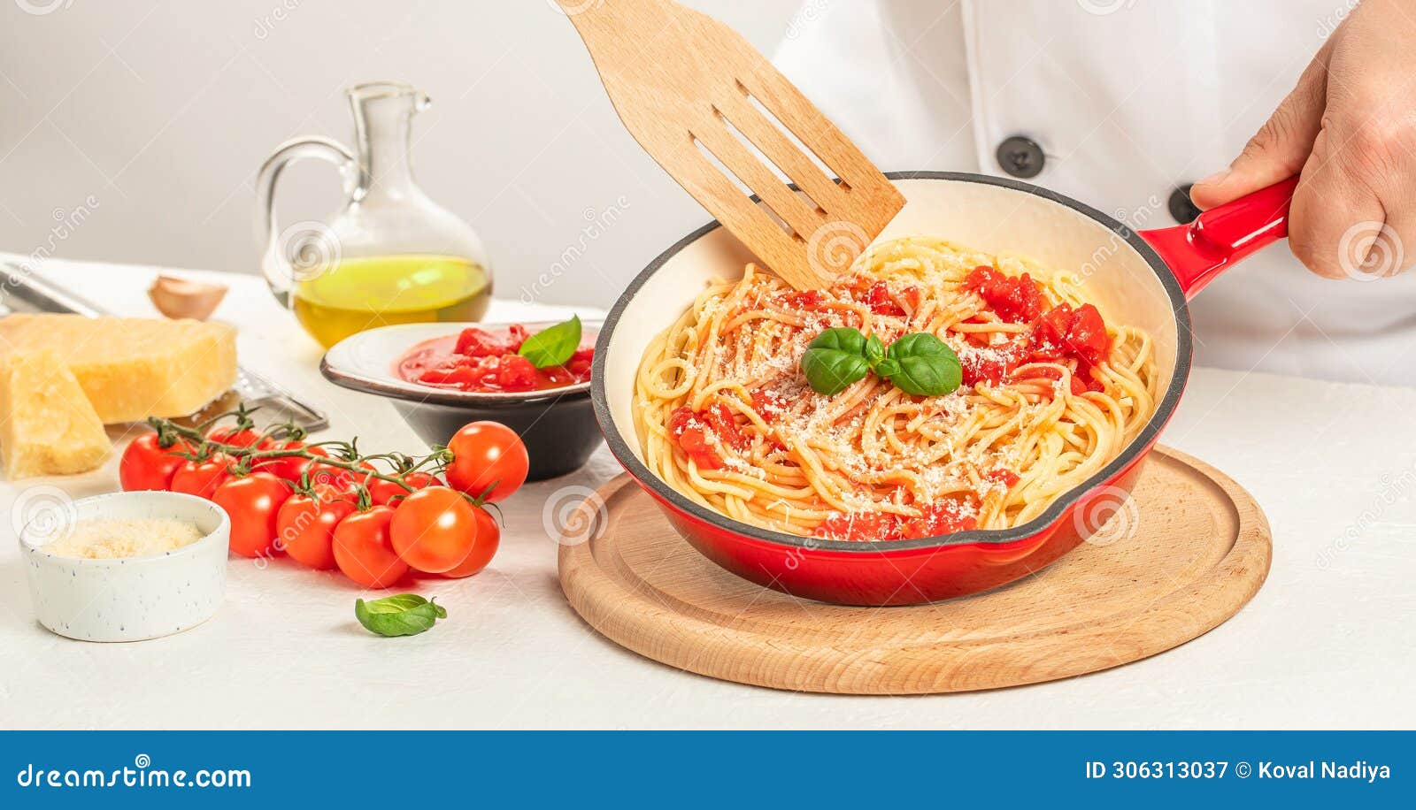 Italian Pasta with Tomatoes and Basil in Pan. Chef Cooking Spaghetti ...