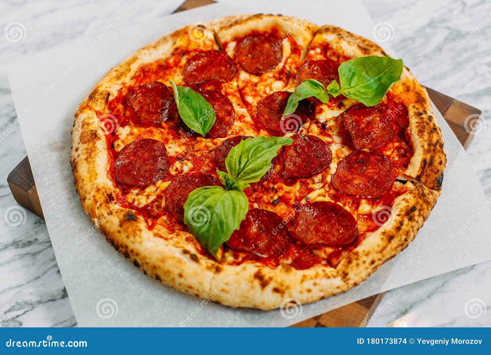 Italian Pizza with Mozzarella Cheese and Basil on a Marble Table Stock ...