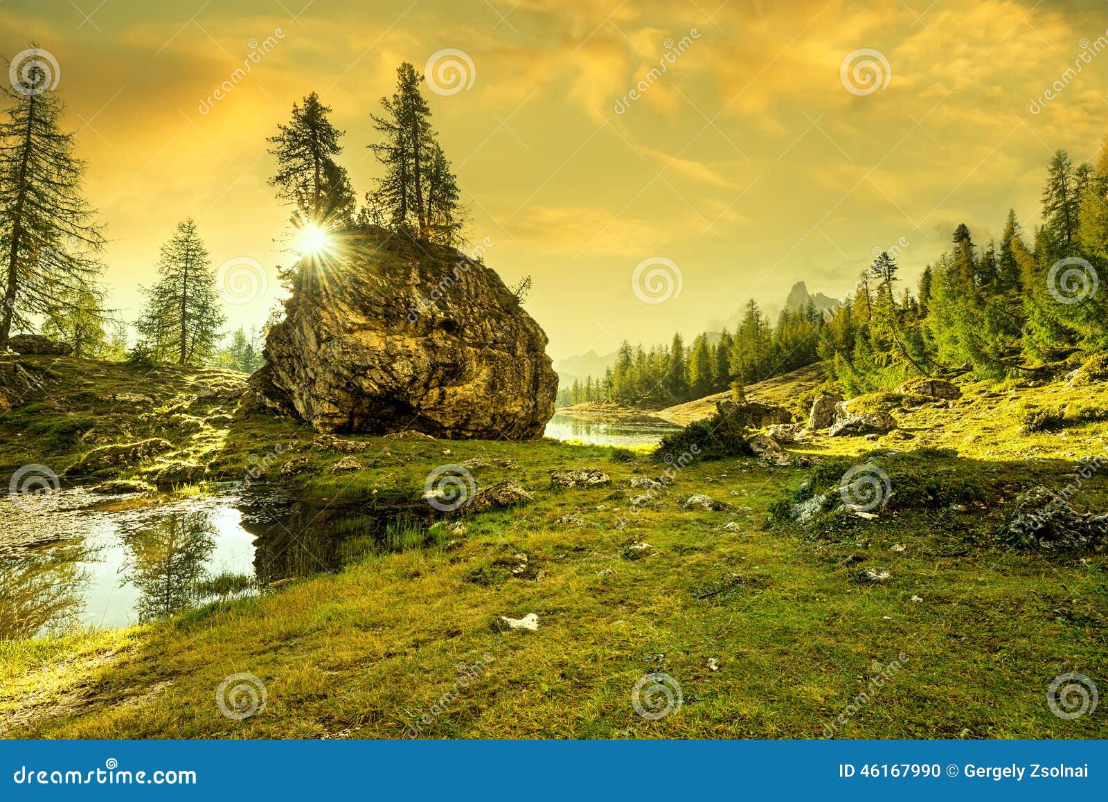 Sunrise Behind Giant Rock Formation Silhouette Stock Image ...