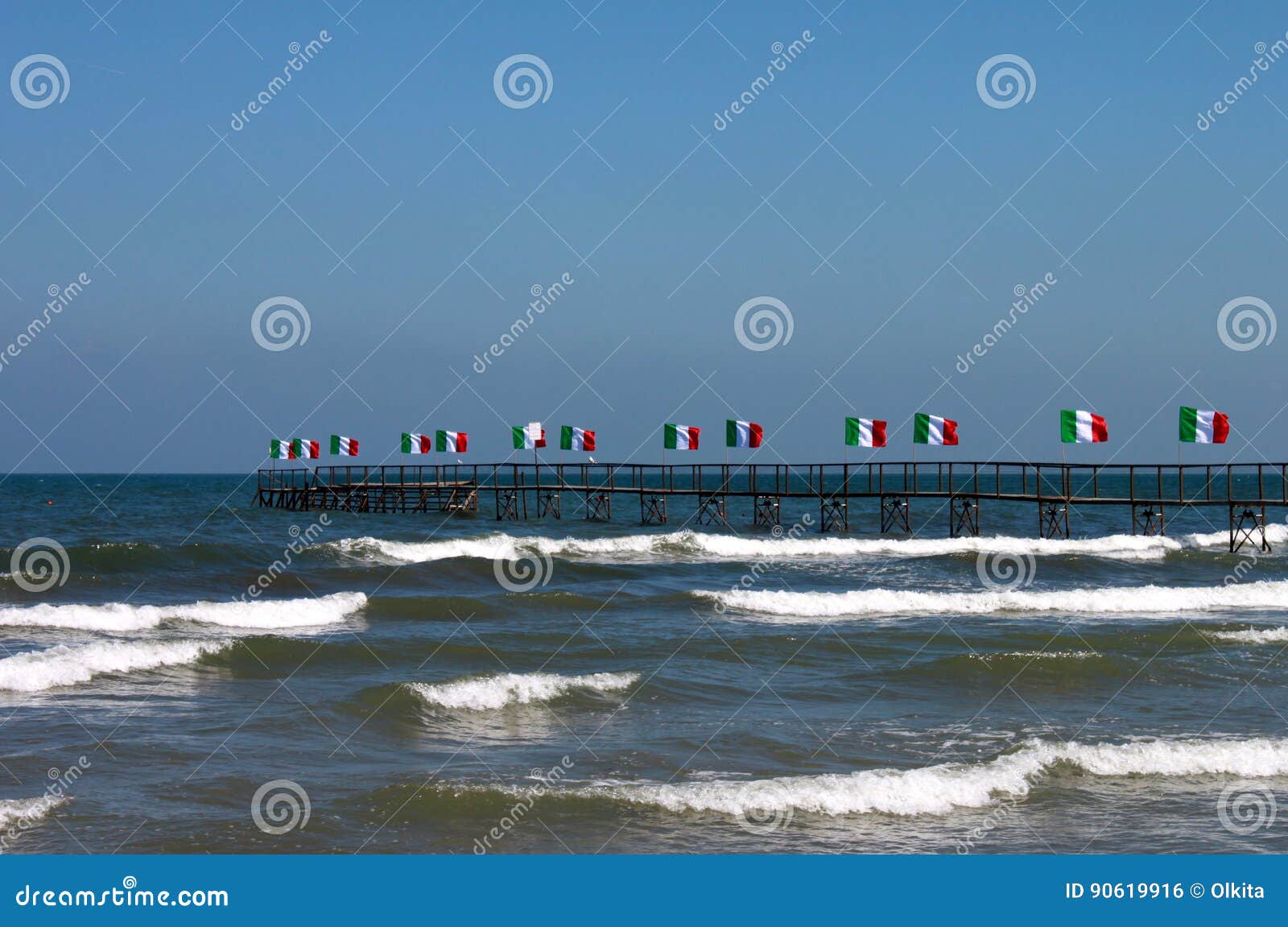 Italy. Emilia-Romagna. Rimini. Group of Flags of Italy and Sea on Blue ...