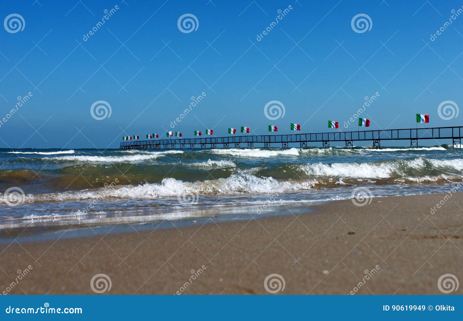 Italy. Emilia-Romagna. Rimini. Group of Flags of Italy and Sea on Blue ...