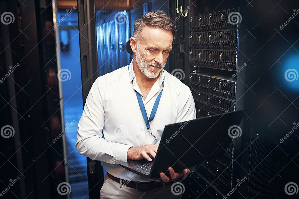 Itll Be Fixed in a Few Seconds. a Mature Man Using a Laptop while ...