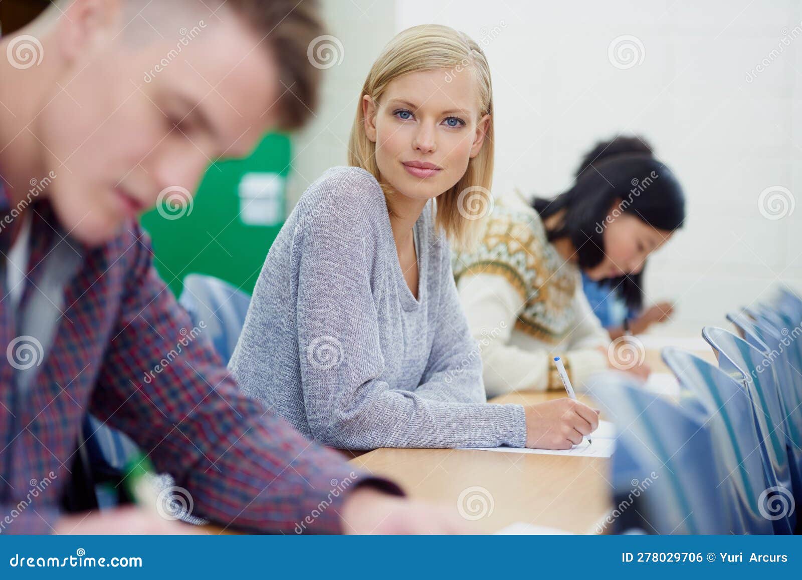 Its All about Good Grades. Portrait of a University Student Writing an ...