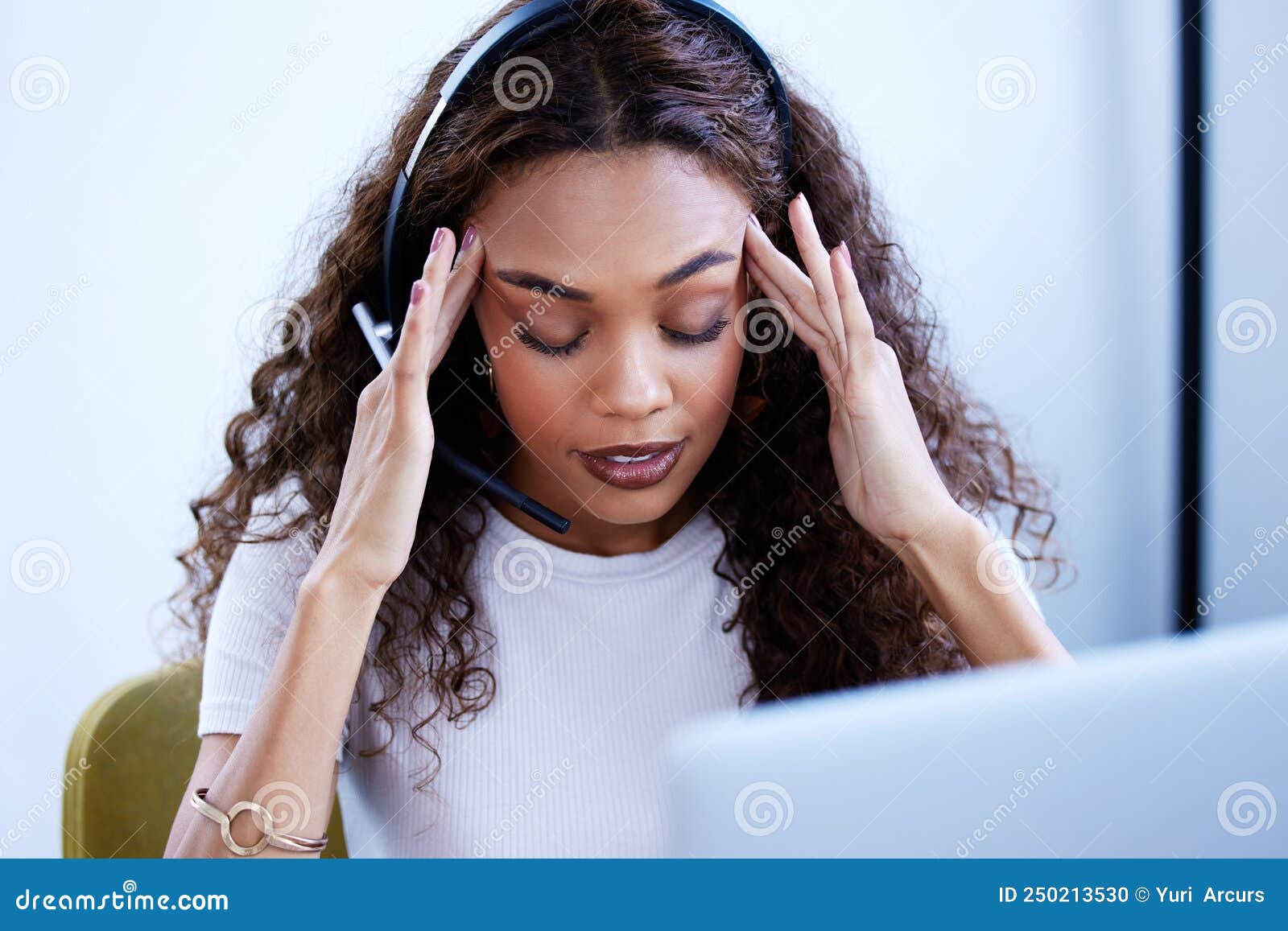 Its Been an Overwhelming Day. Shot of a Young Call Centre Agent Looking ...