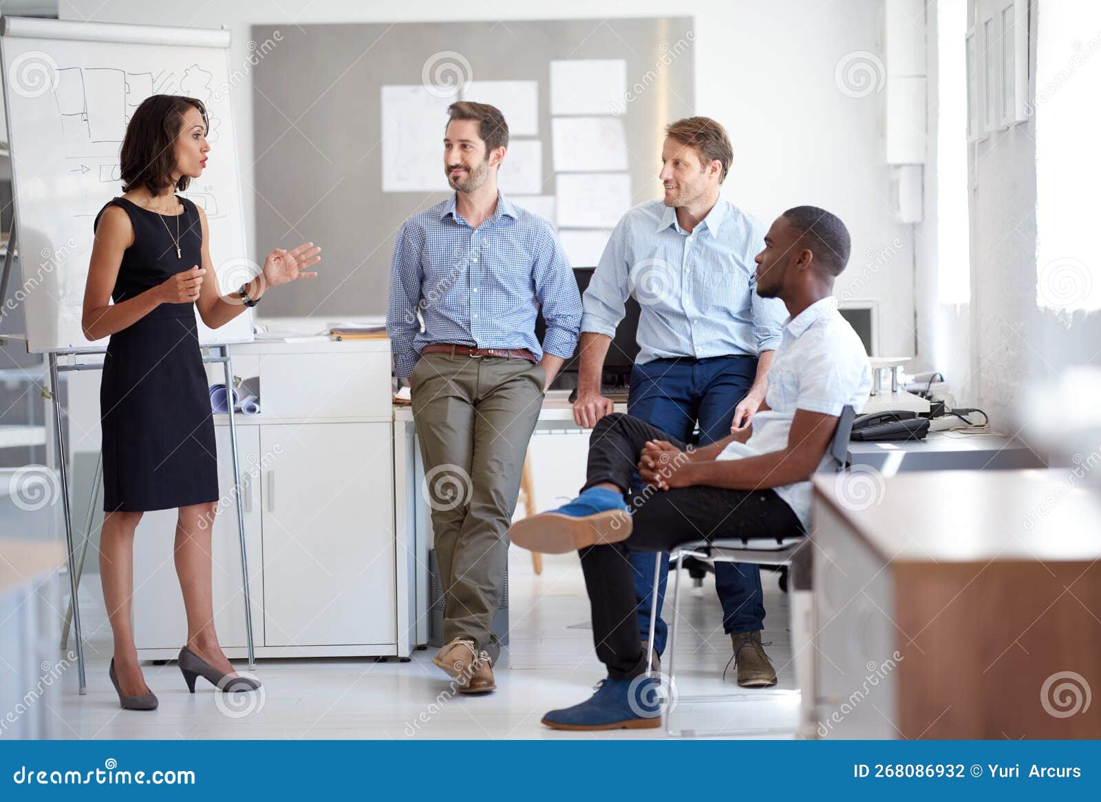 Its a Creative Environment. a Group of Designers Talking Together in a ...