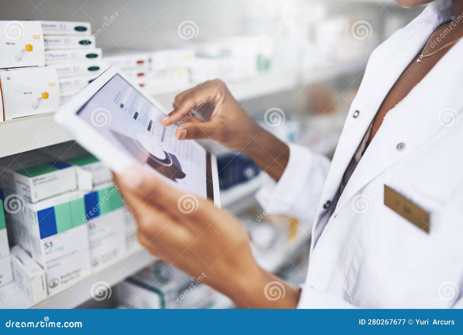 Its Easy, Efficient and Powerful. a Pharmacist Using a Digital Tablet ...