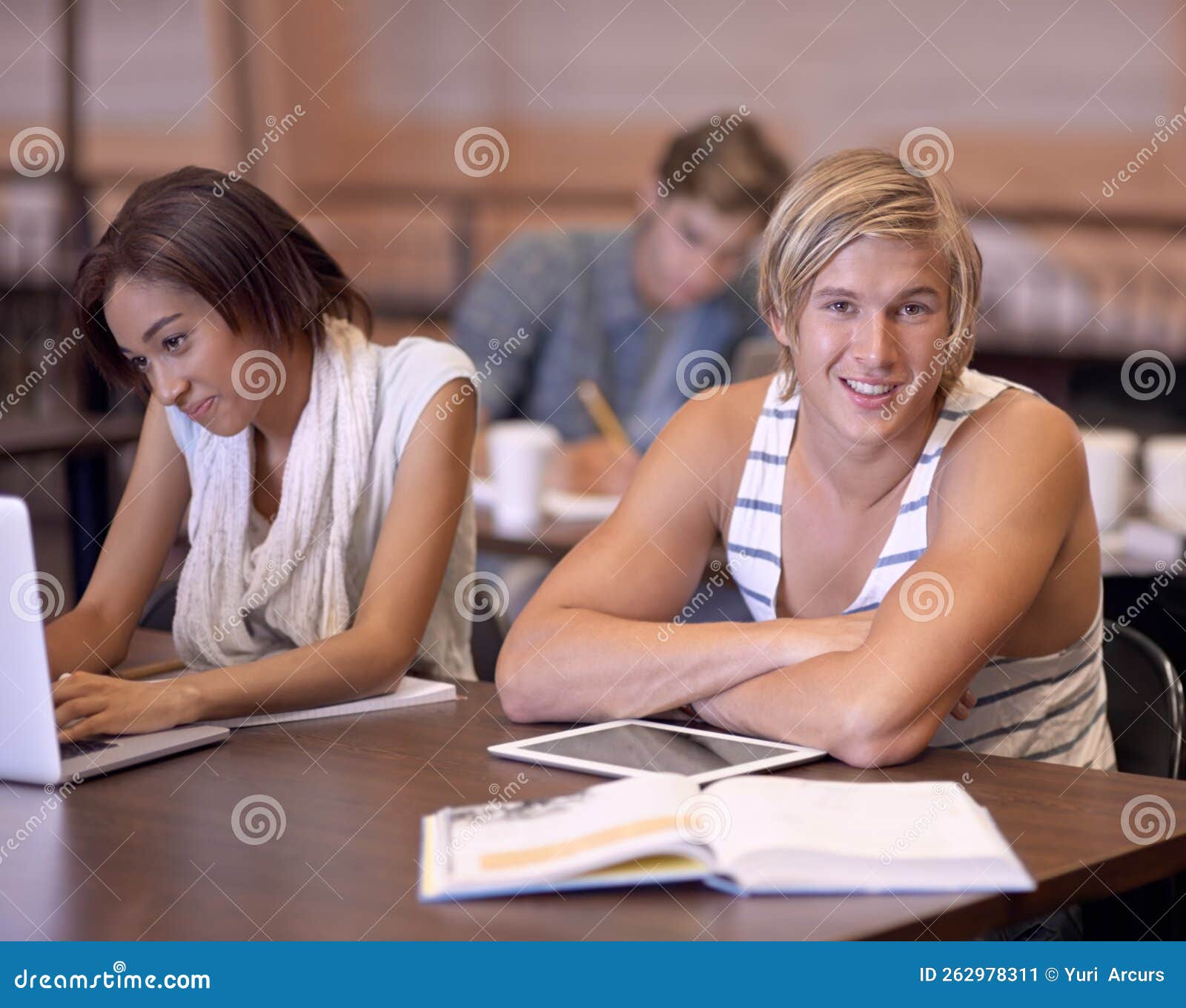 Its Great To Have a Study Partner. a Young Man Studying for Exams in the Library. Stock Image ...