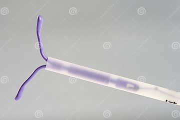 IUD Birth control device stock image. Image of face, device - 42232245