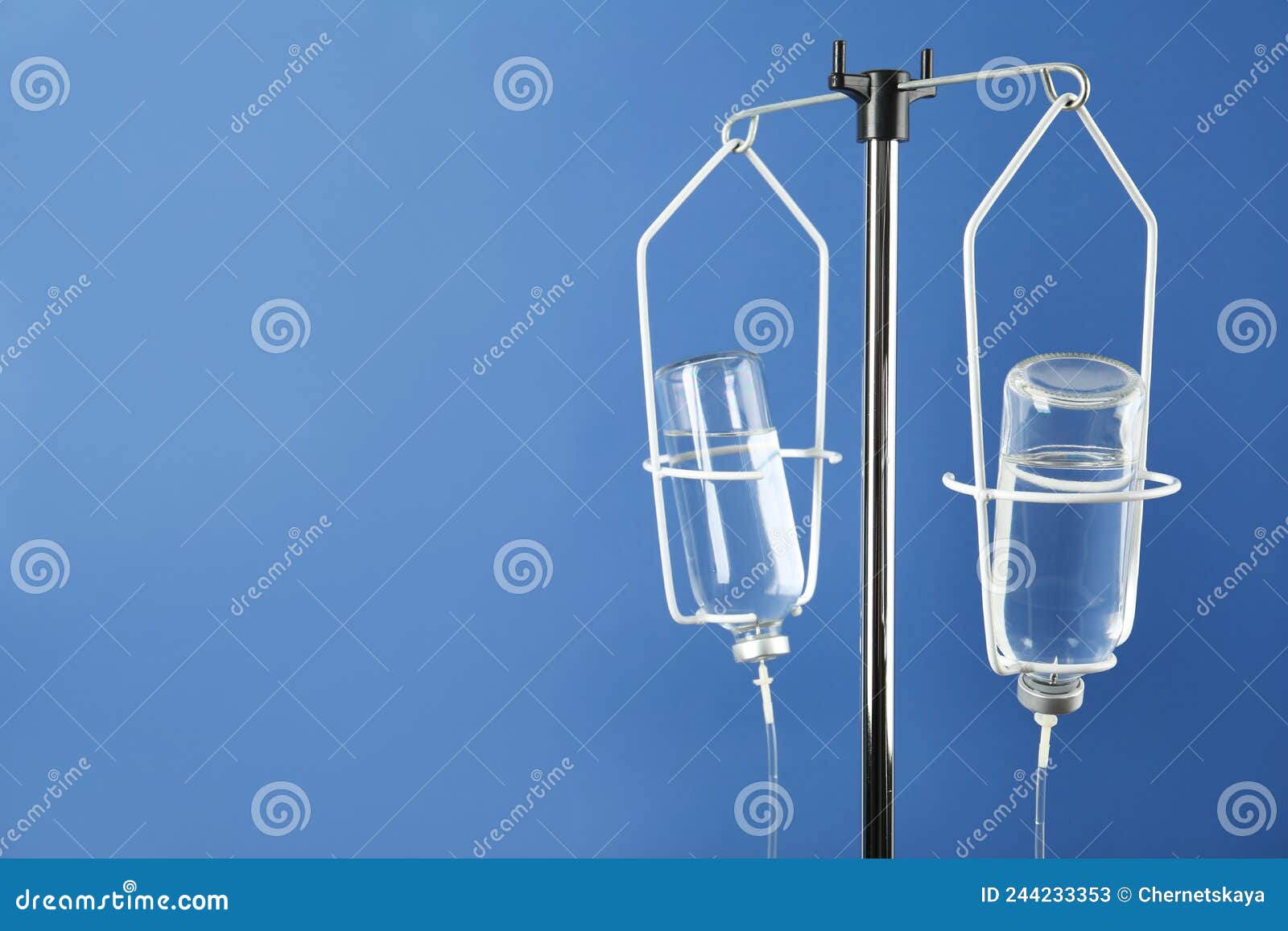 IV Infusion Set on Blue Background. Space for Text Stock Image - Image ...