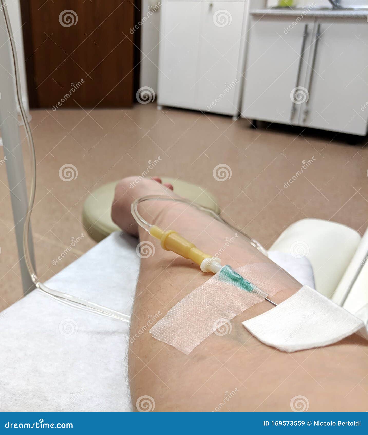 IV Needle in Arm of Patient Laying Down Stock Image - Image of ...