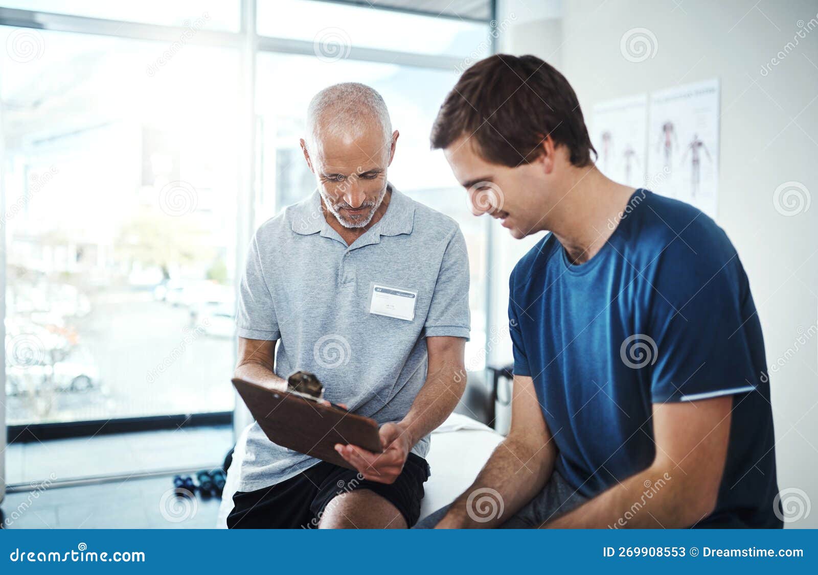 Ive Devised a Treatment Program for You. a Physiotherapist Having a ...