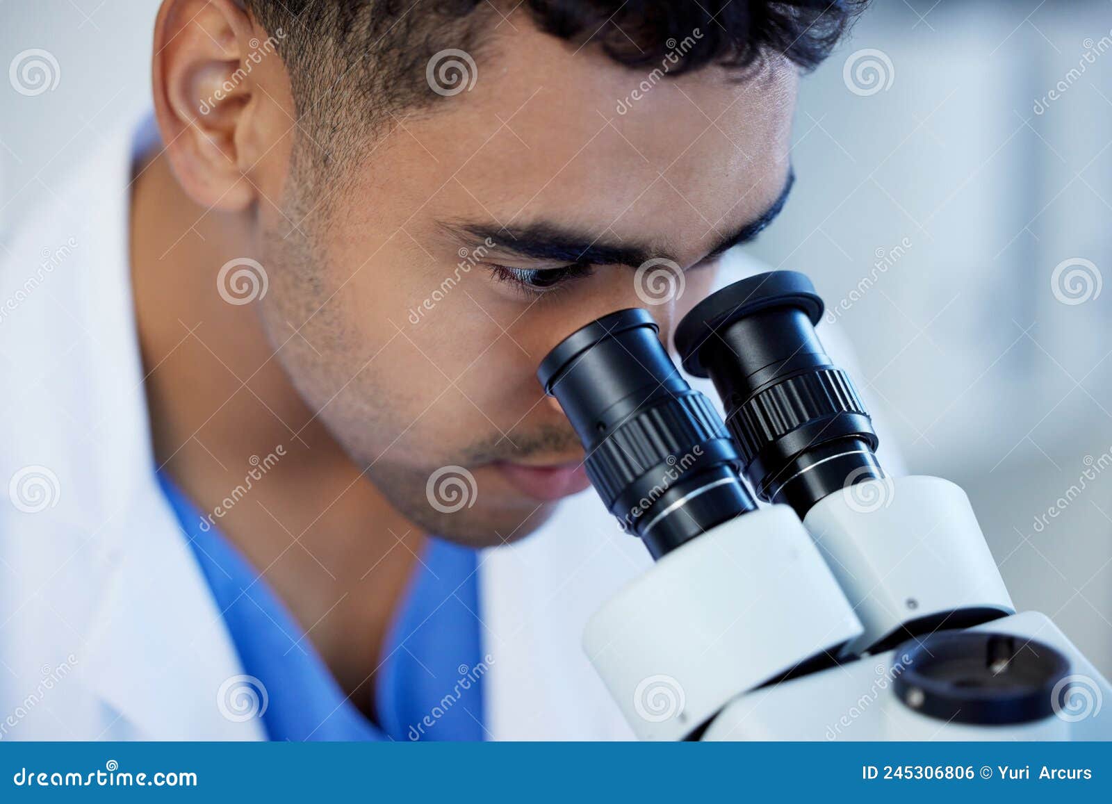 Ive Noticed Something.... Shot of a Young Man Using a Microscope in a ...