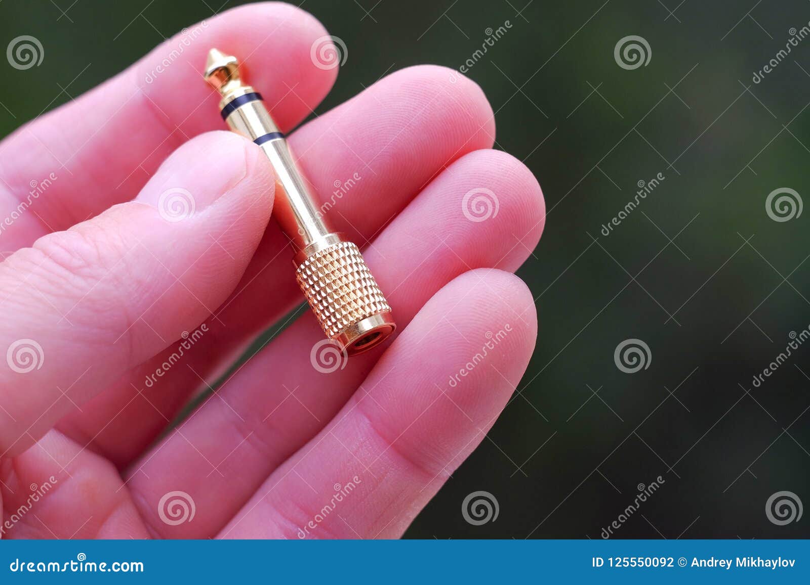 Jack Adapter between Finger Stock Photo - Image of cord, white: 125550092