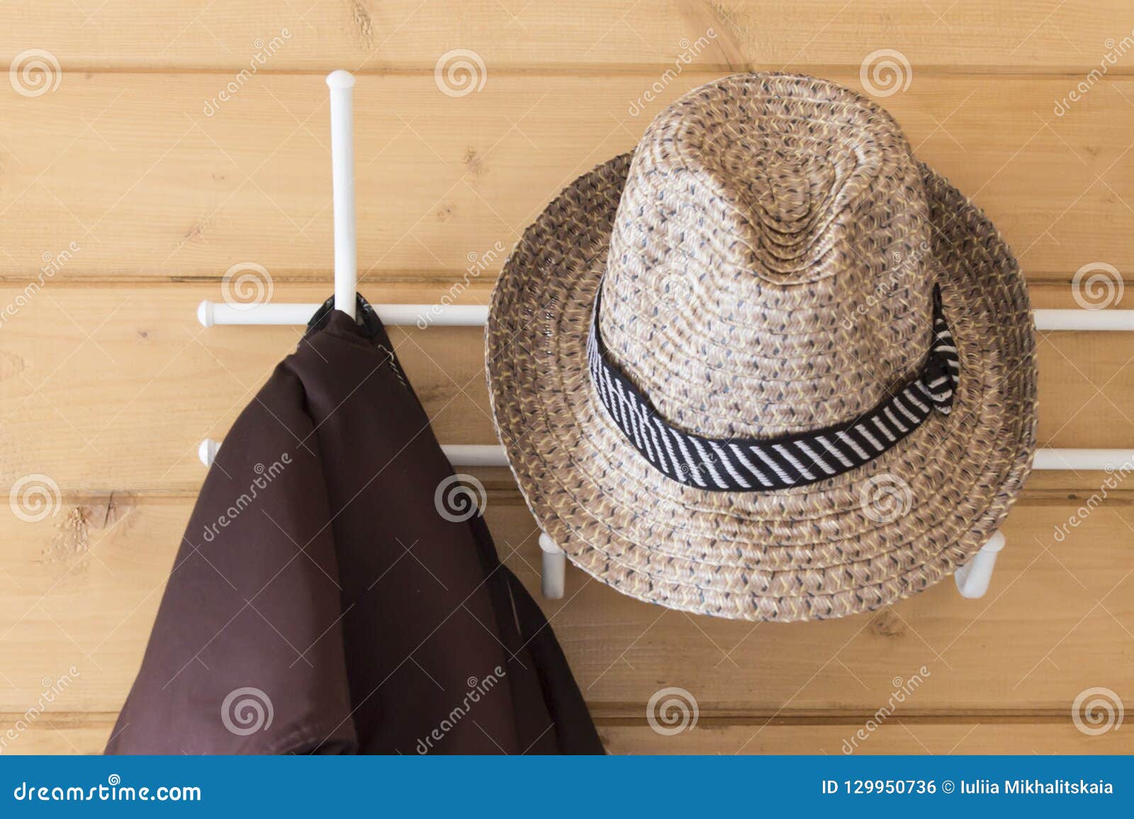 Jacket and Hat Hanging on the Hanger in the Hallway Stock Photo - Image ...
