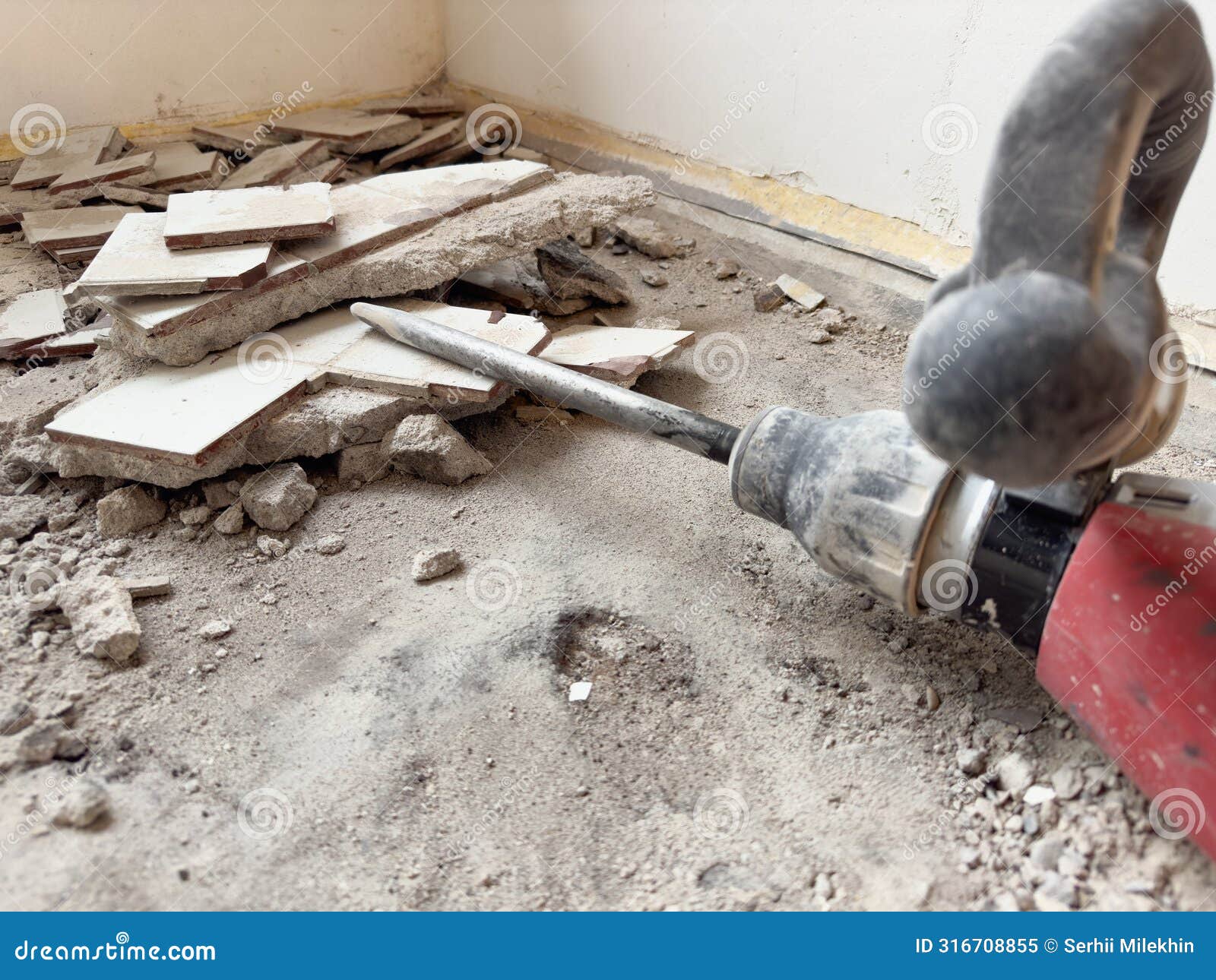 A Jackhammer Lies on Pieces of Broken Ceramic Tiles. Construction ...