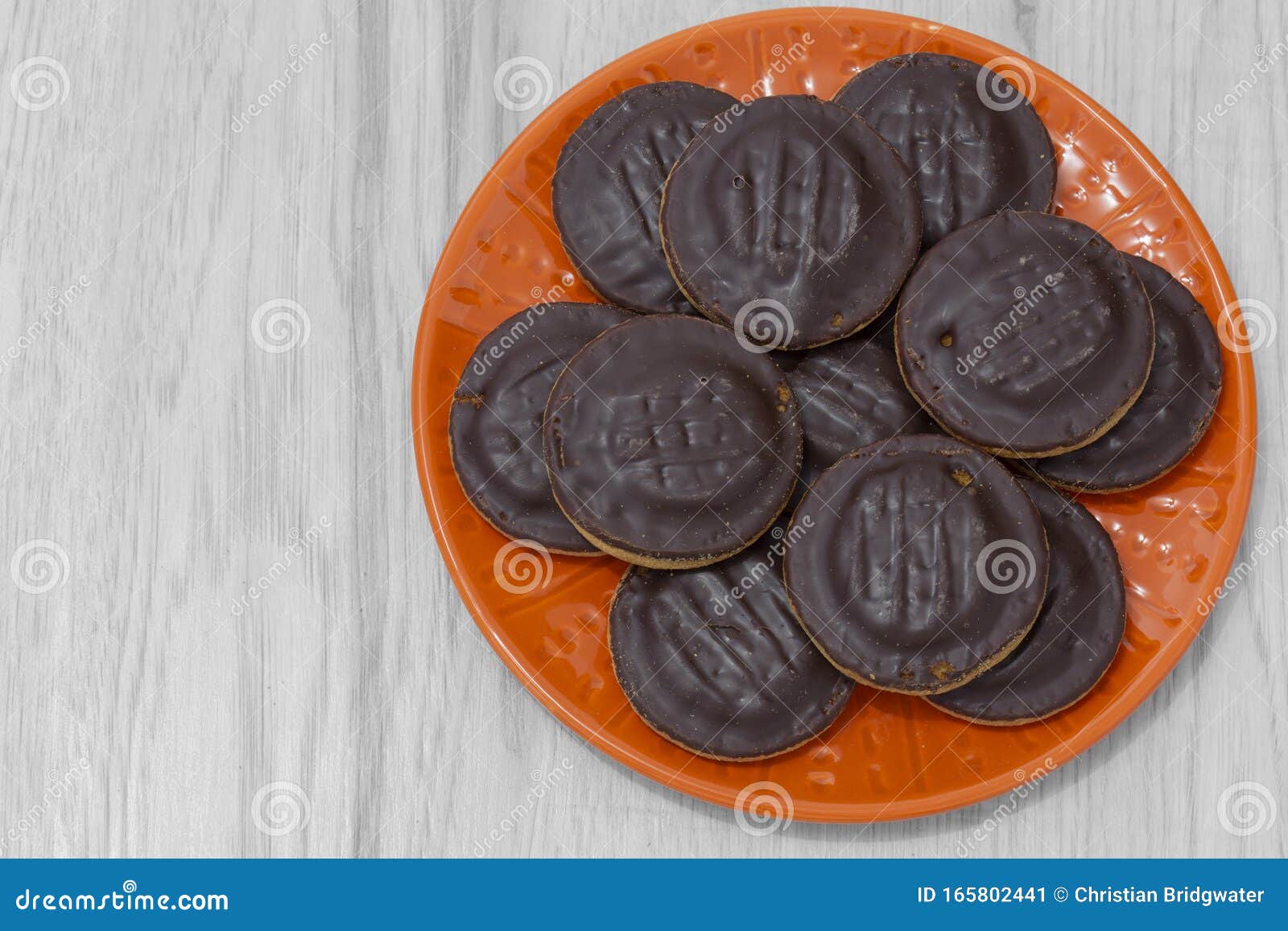 Jaffa Cakes Biscuits Stacked on an Orange Plate. Stock Image - Image of ...