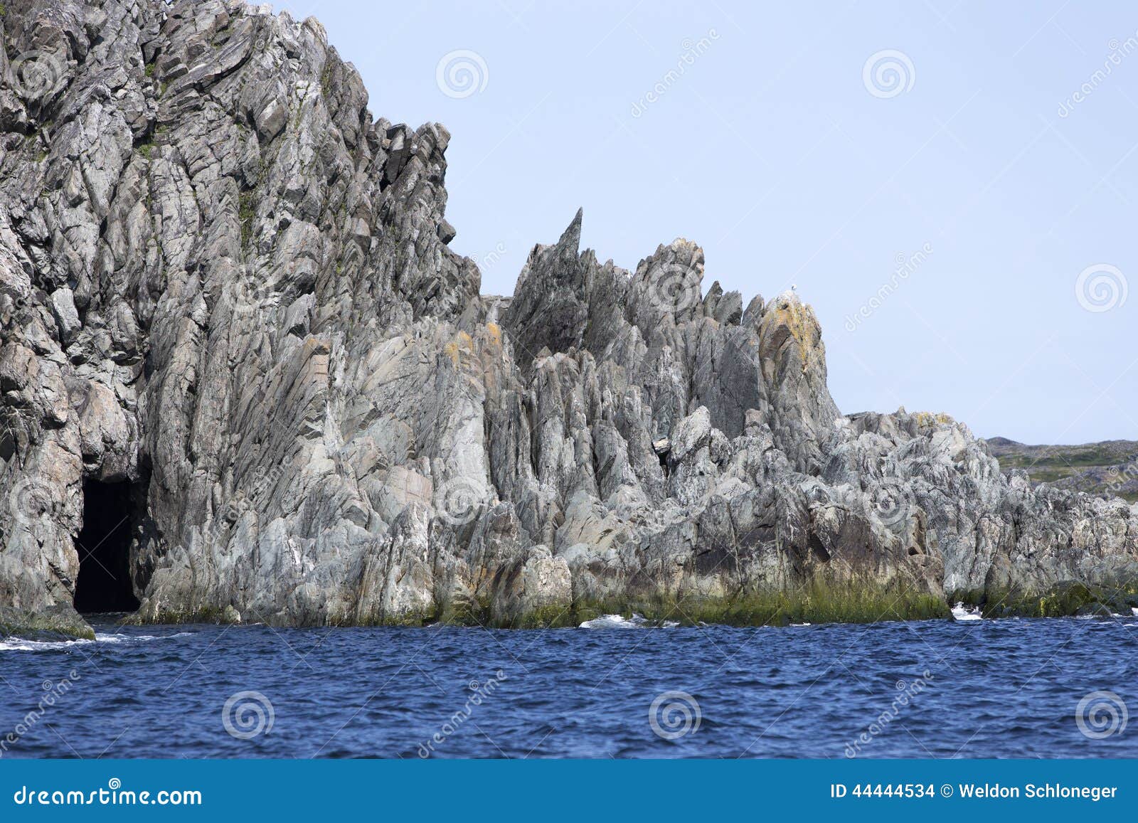 Jagged Rocks and Cave, St. Anthony, Newfoundland Stock Photo - Image of ...