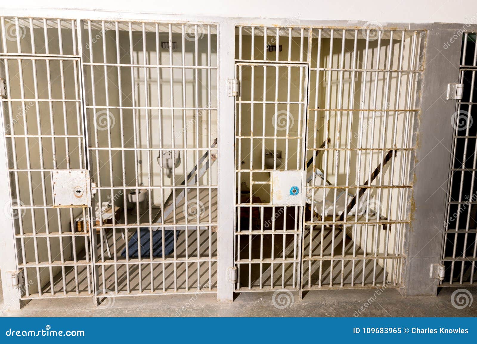 Cell Block Jail Bars and Beds in a Prison Stock Image - Image of ...