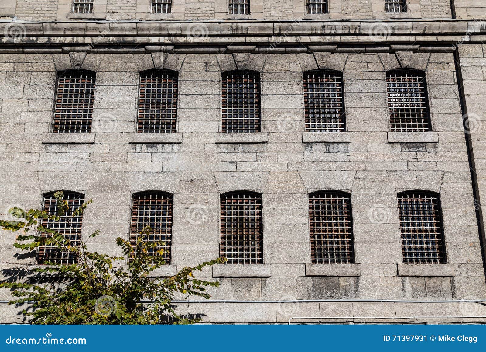 Jail windows with bars stock image. Image of stone, building - 71397931