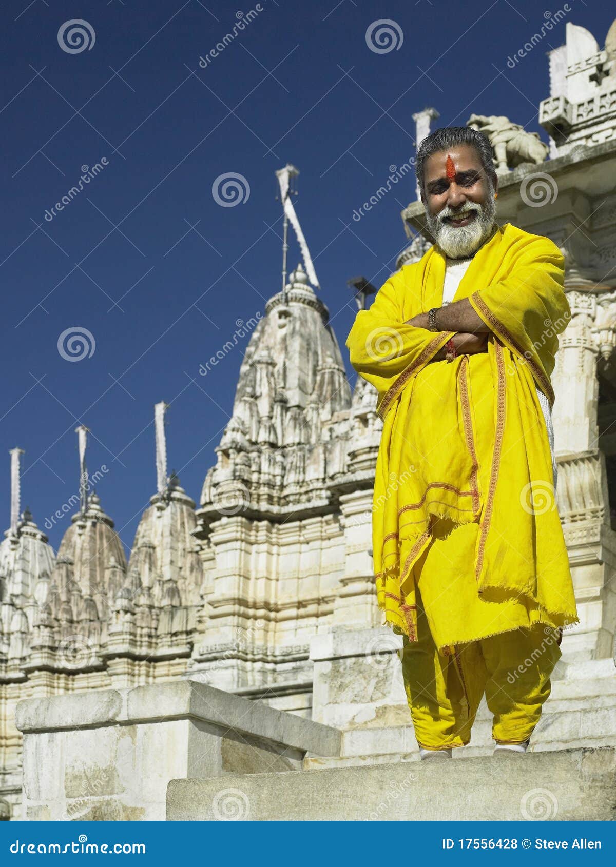 A Temple Priest Walks Through The Streets Of Kandy During The Day ...