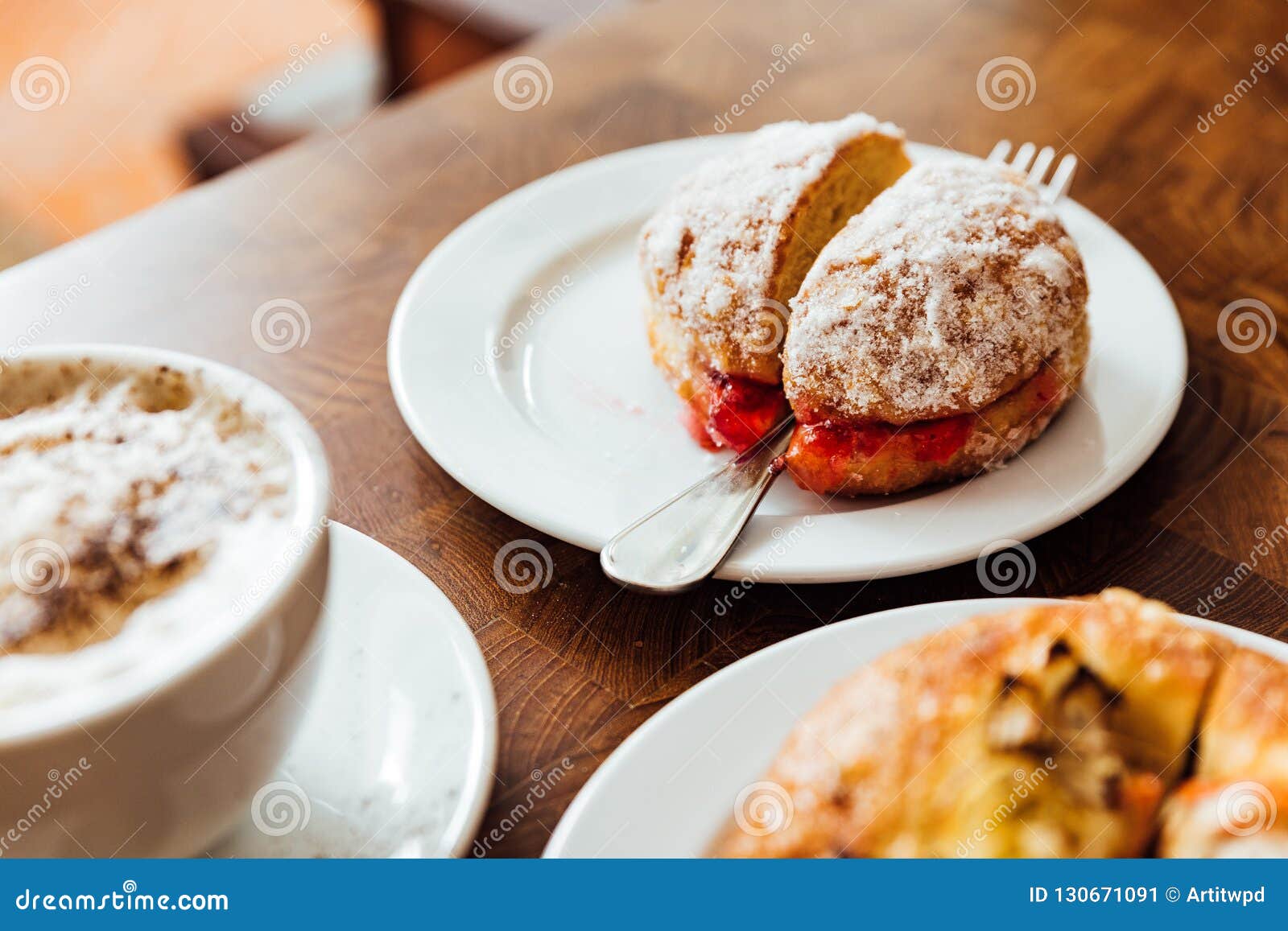 Jam Berliner Cut in Half that Topping with Icing Sugar Stock Image ...