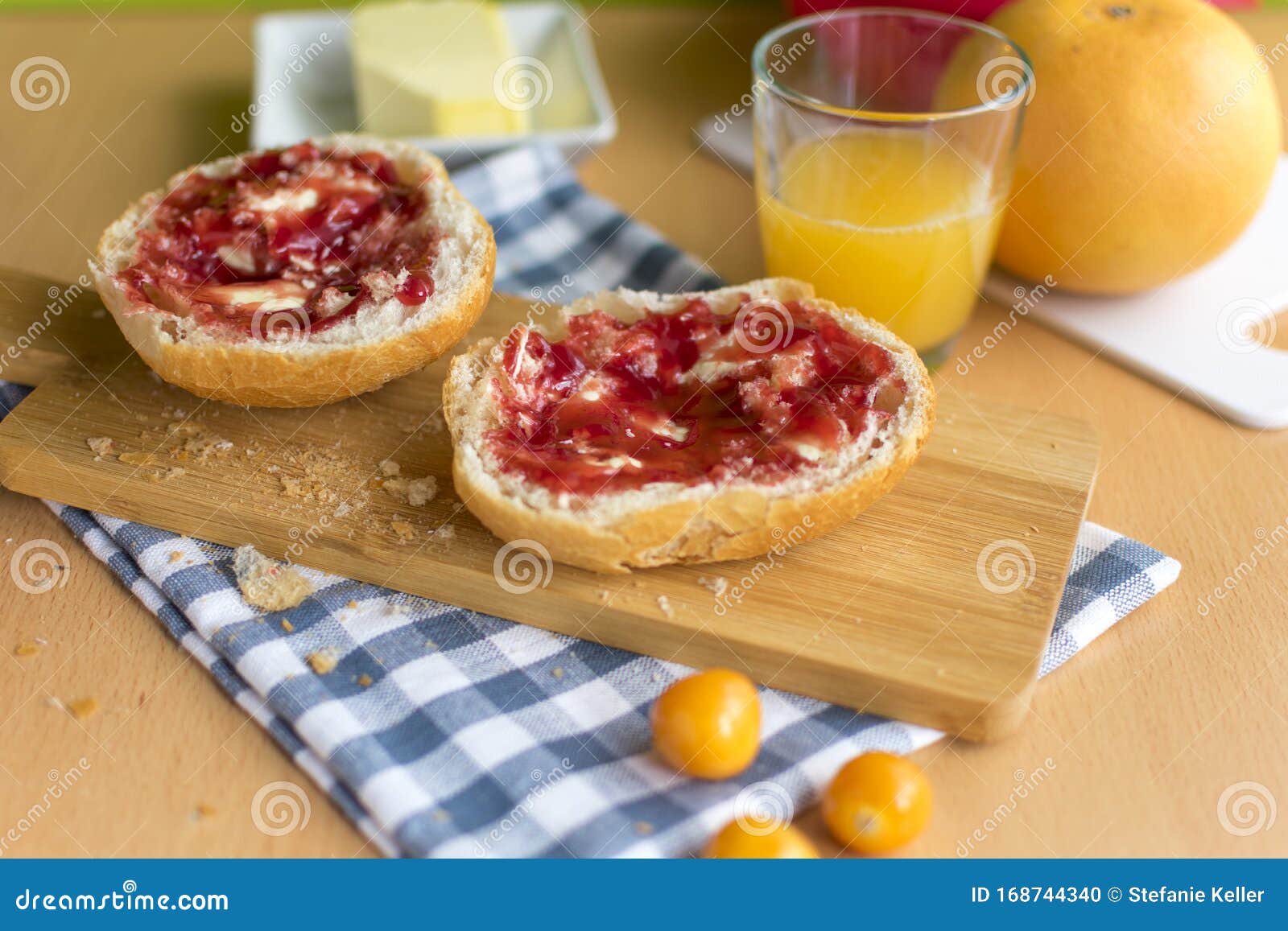 Jam Bun on a Wooden Board with Orange Juice Stock Photo - Image of ...