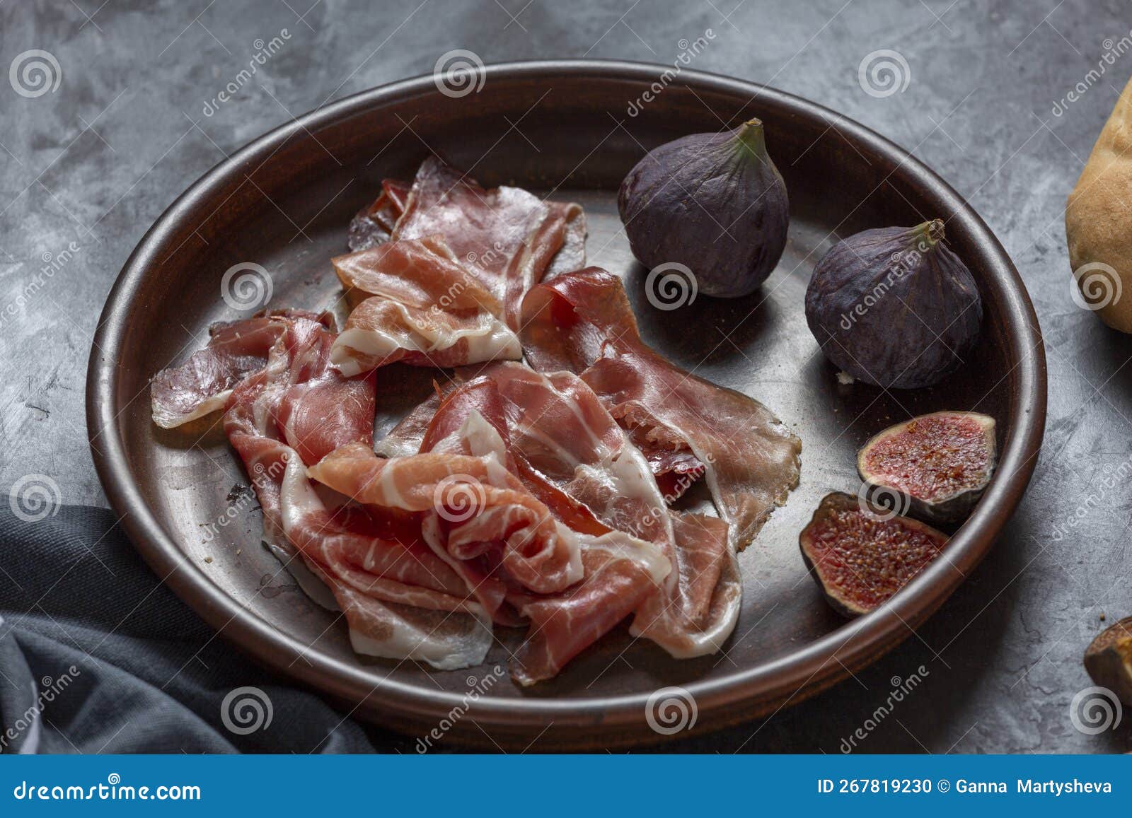 Jamon with Figs and a Baguette with Cream Cheese on the Dining Table ...