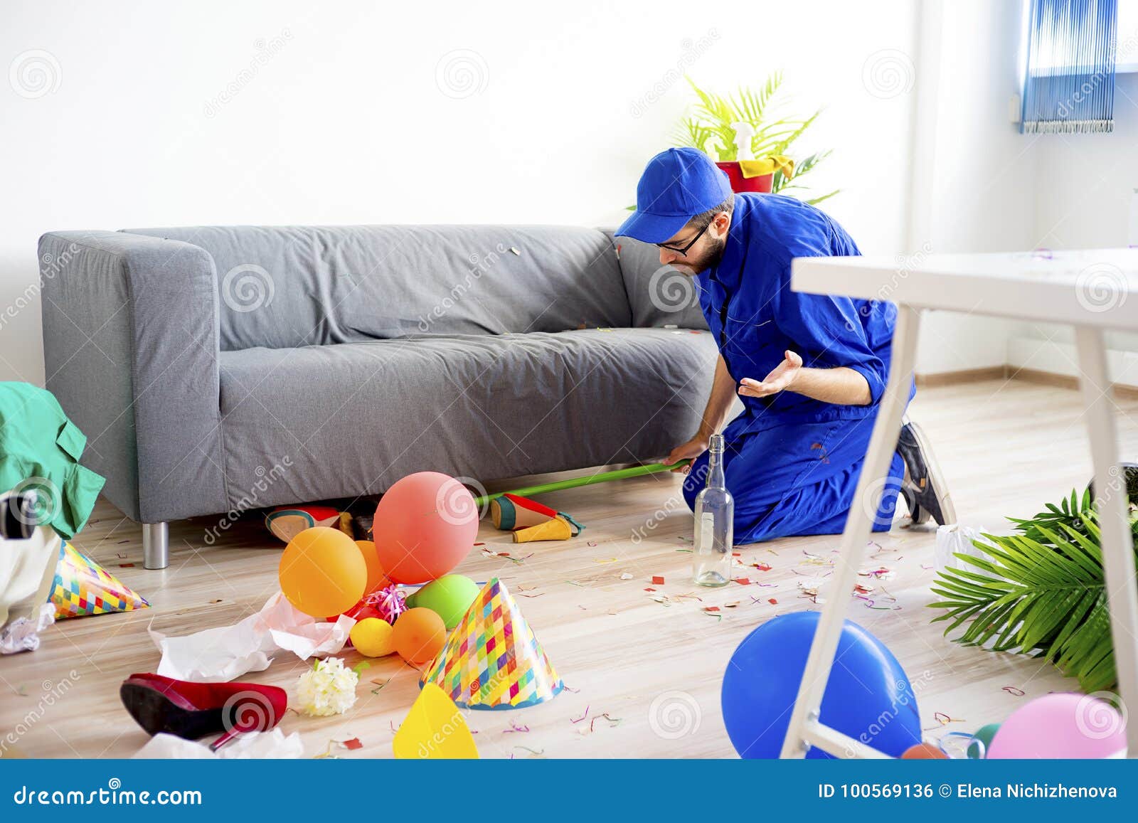 Janitor cleaning a mess stock photo. Image of person - 100569136